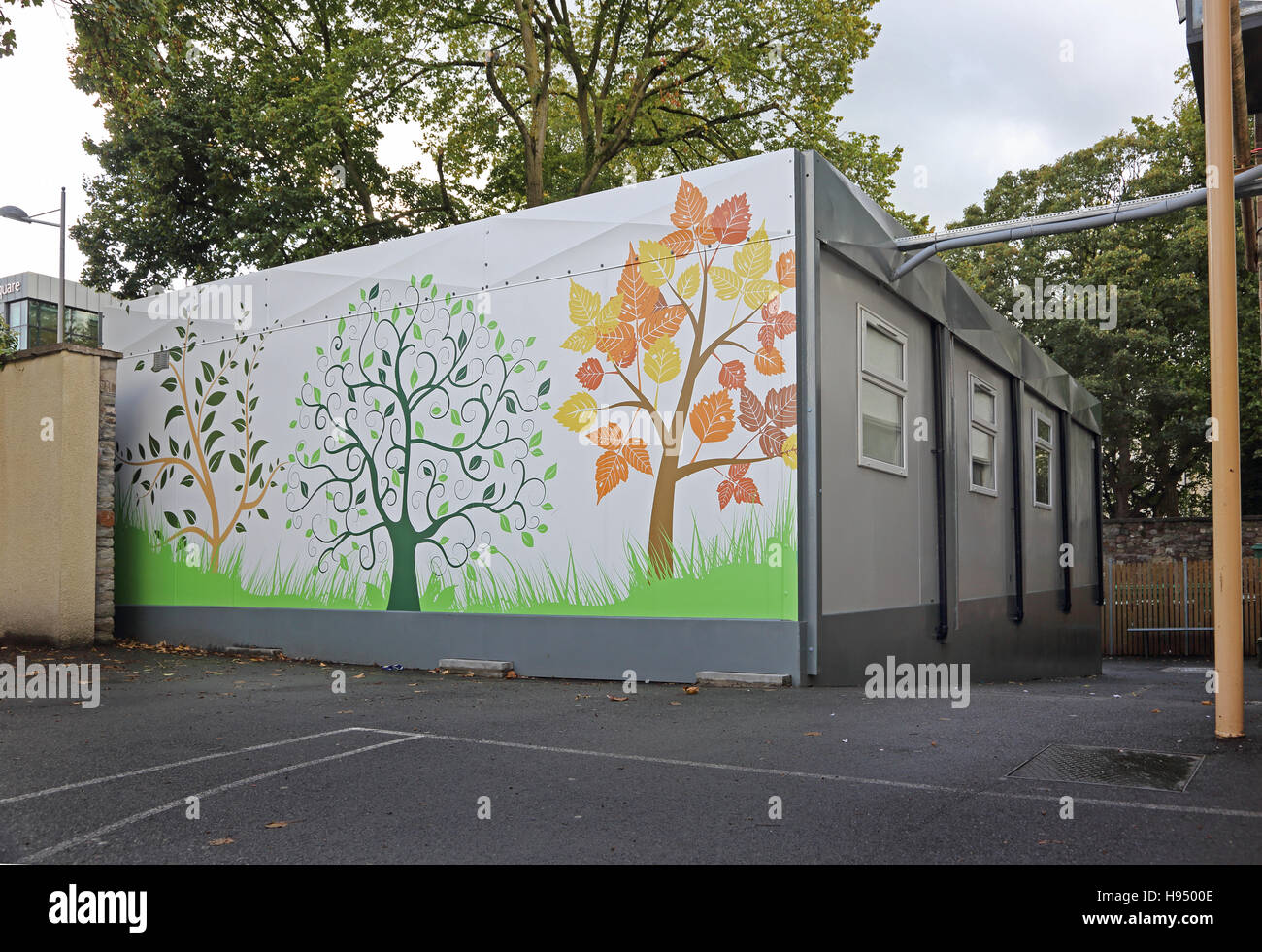A temporary school classroom externally painted by pupils with a series ...