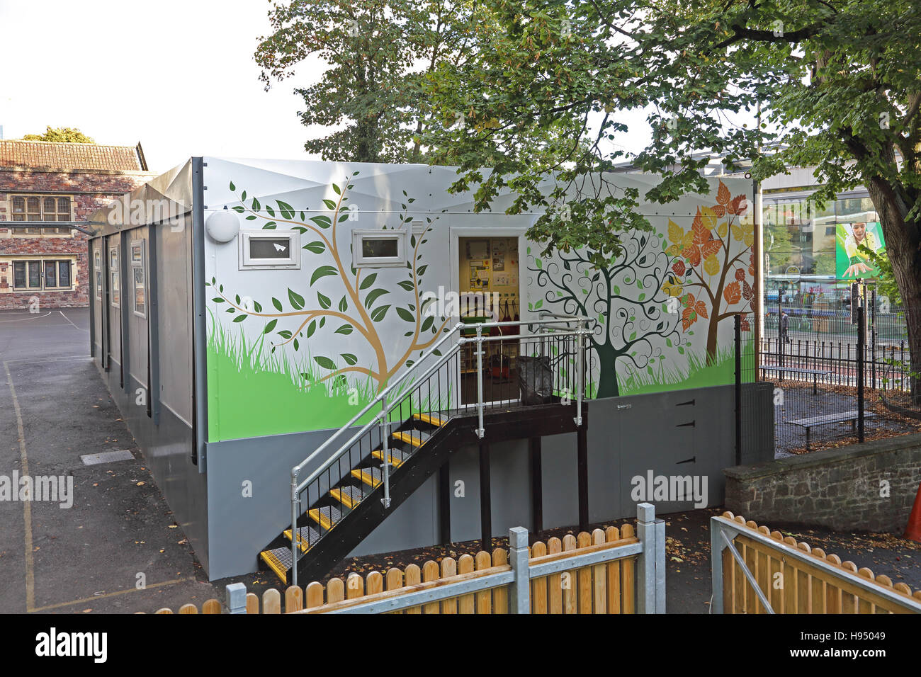 A temporary school classroom externally painted by pupils with a series ...