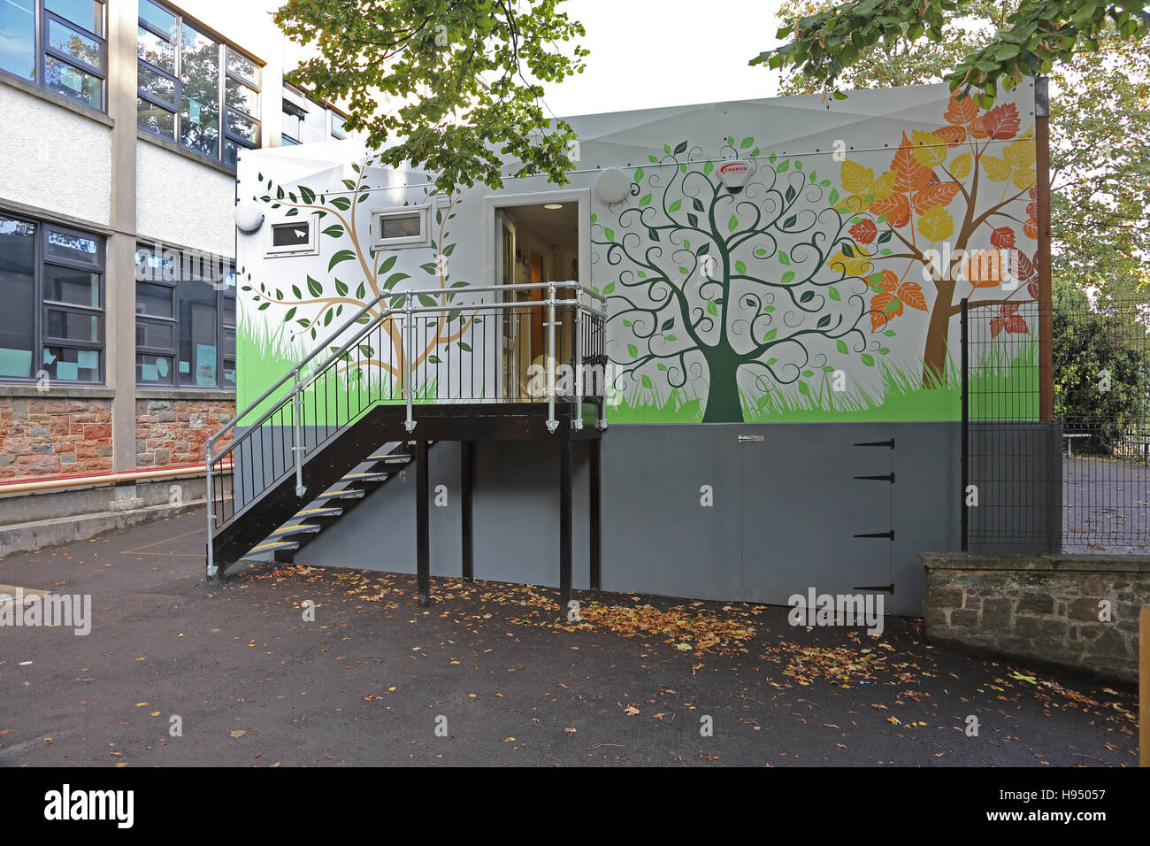 A temporary school classroom externally painted by pupils with a series ...
