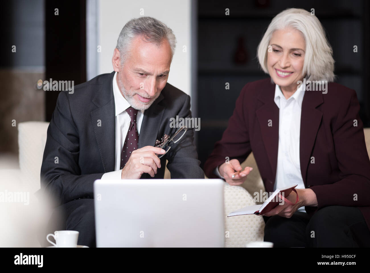 Involved businessman sharing points of view with his colleague Stock ...