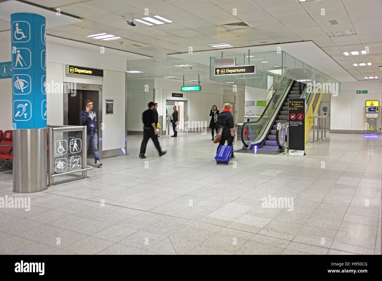 Interior of Gatwick Airport's North Terminal showing lift and escalator ...