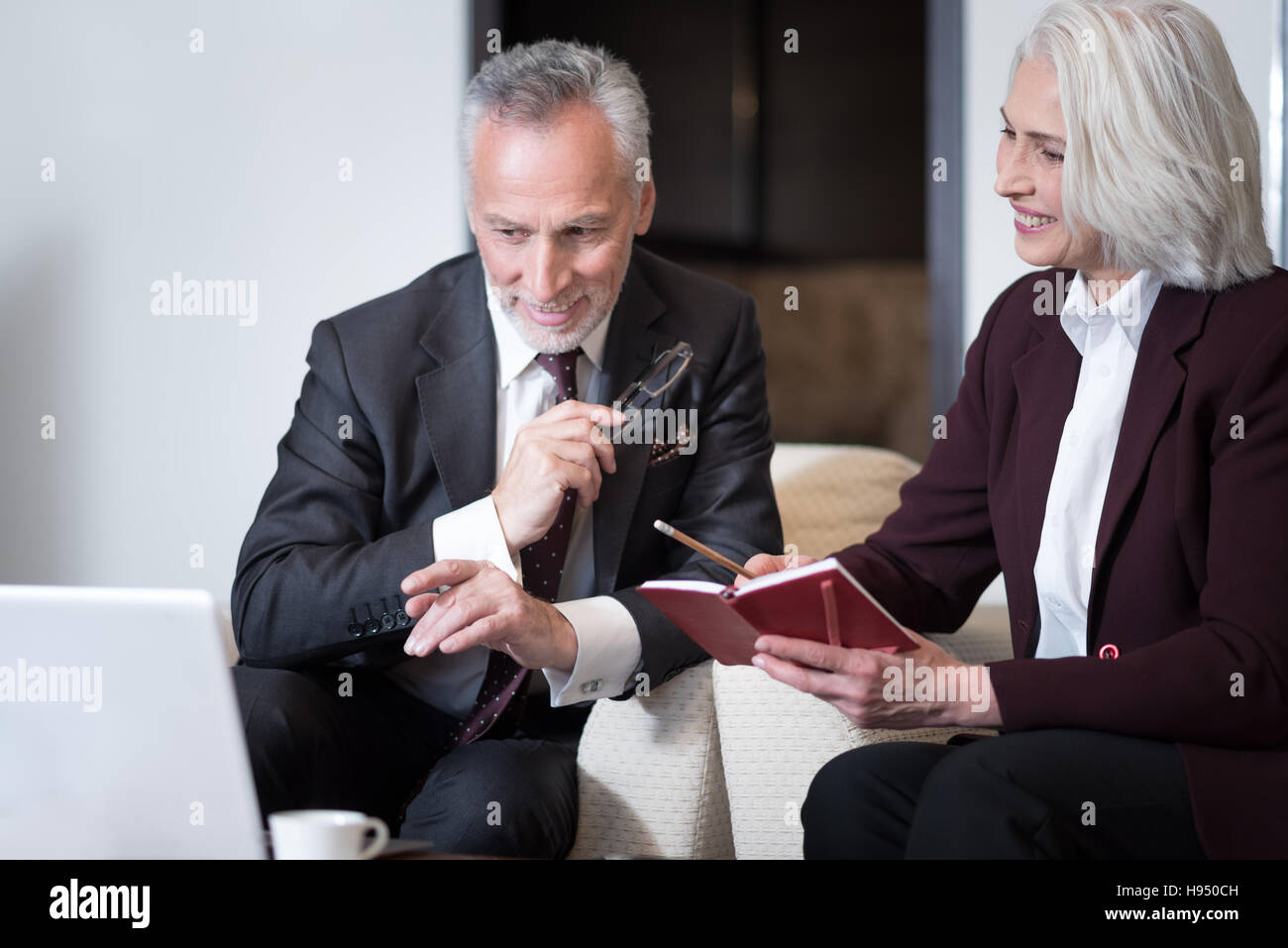 Cheerful businessman sharing points of view with the businesswoman ...