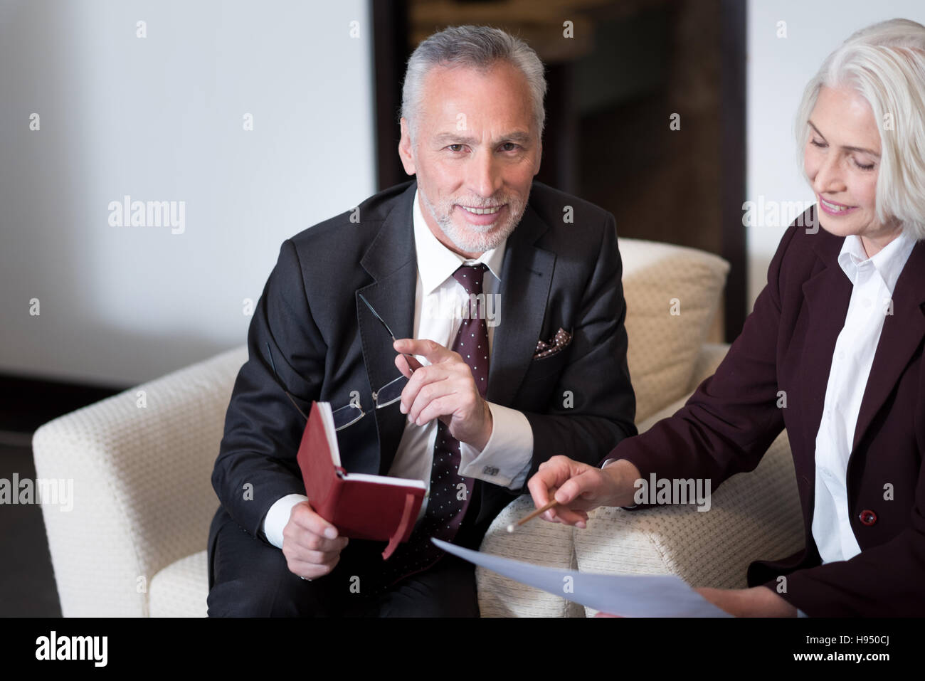 Cheerful businessman sharing points of view with the businesswoman ...