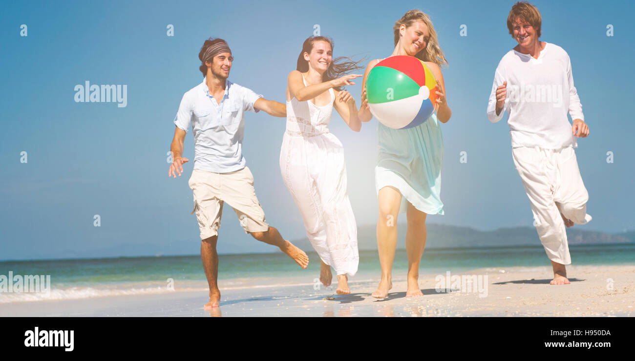 Two couple relaxing on the beach Concept Stock Photo - Alamy