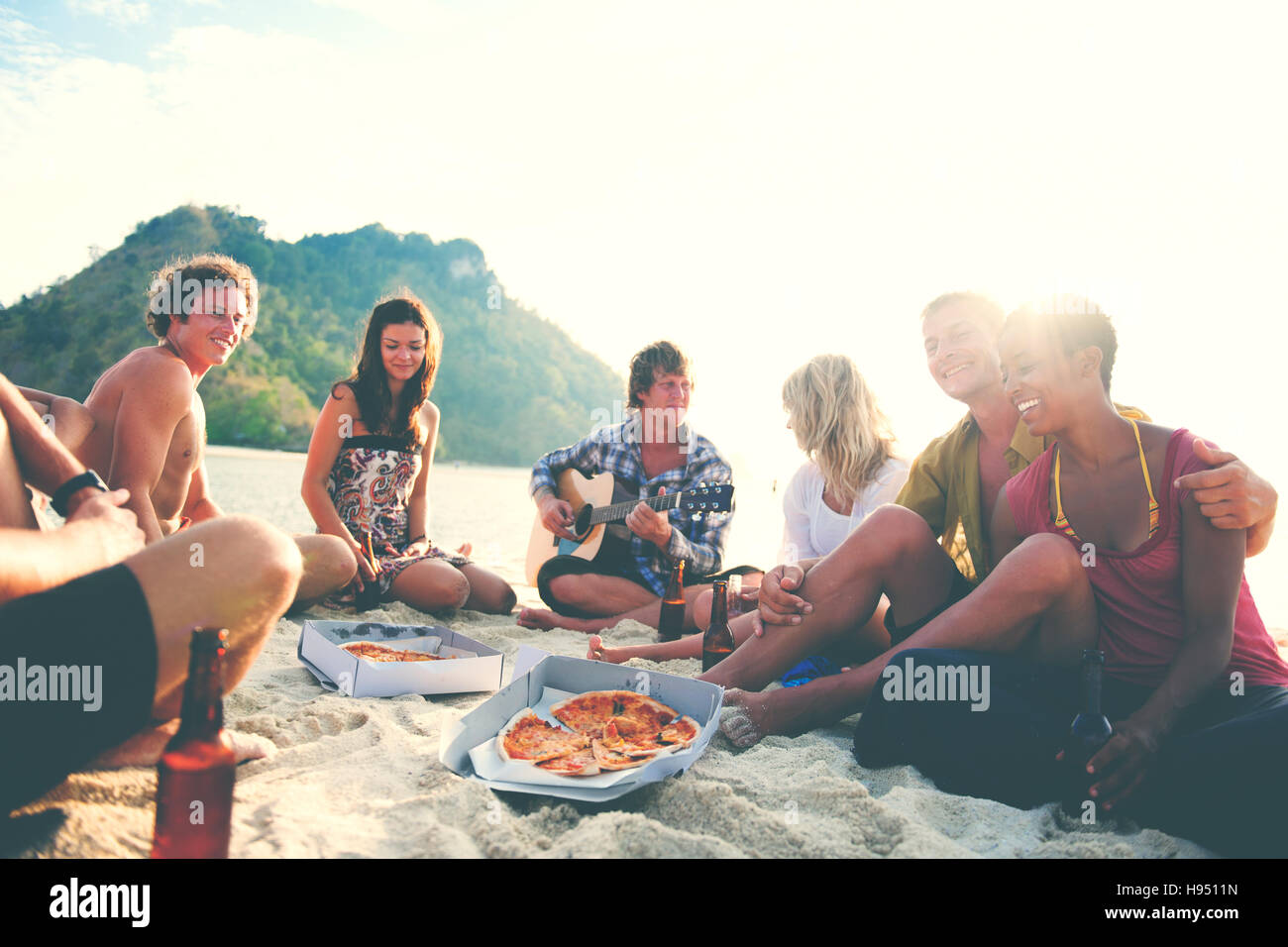Group of friends having a summer beach party Concept Stock Photo - Alamy