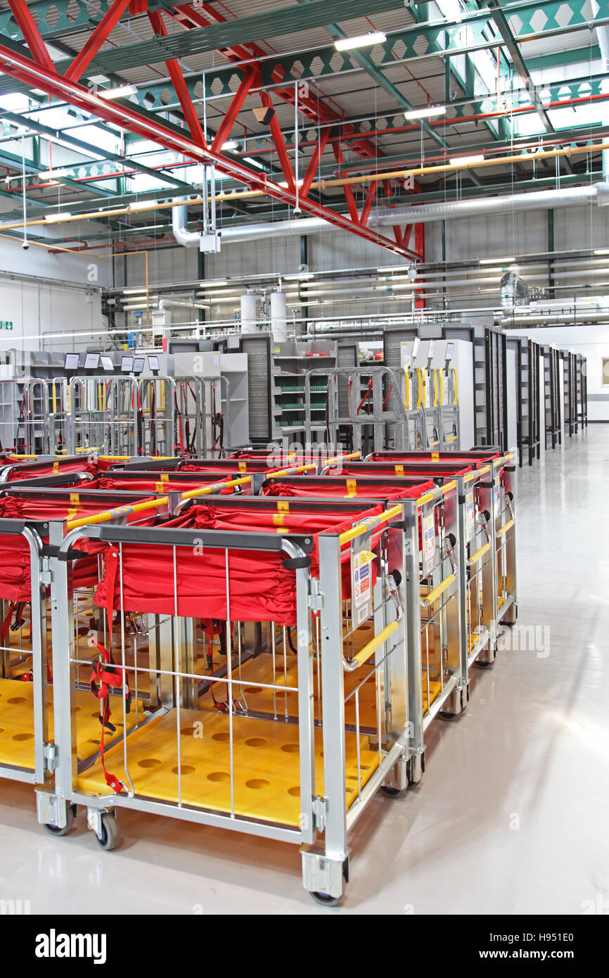 Empty mail trolleys awaiting use in a new Post Office sorting office in ...