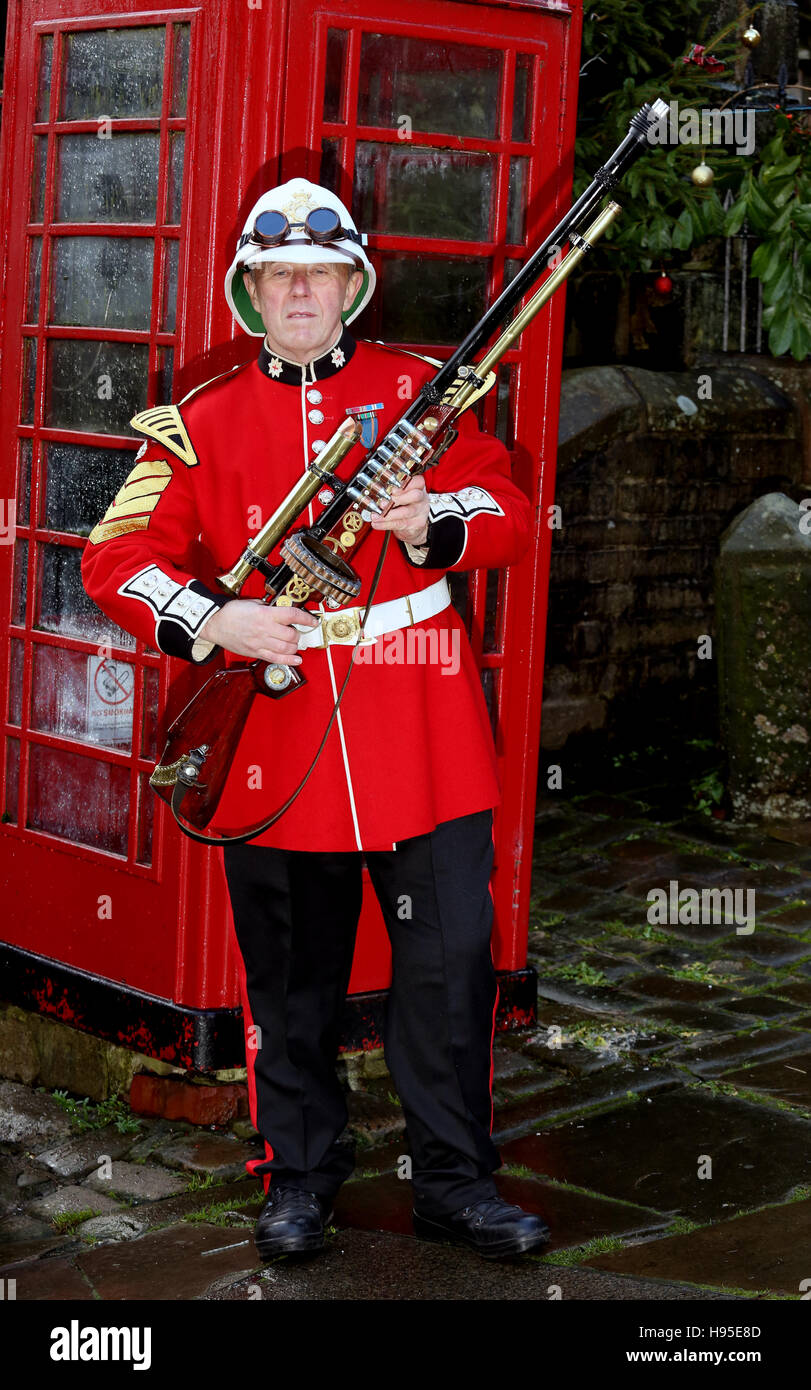 Haworth, UK. 19th Nov, 2016. A man wearing a red army uniform, holding ...