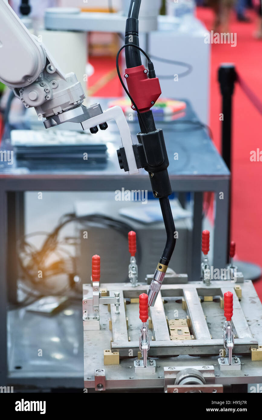 Robotic arm at production line in factory Stock Photo - Alamy