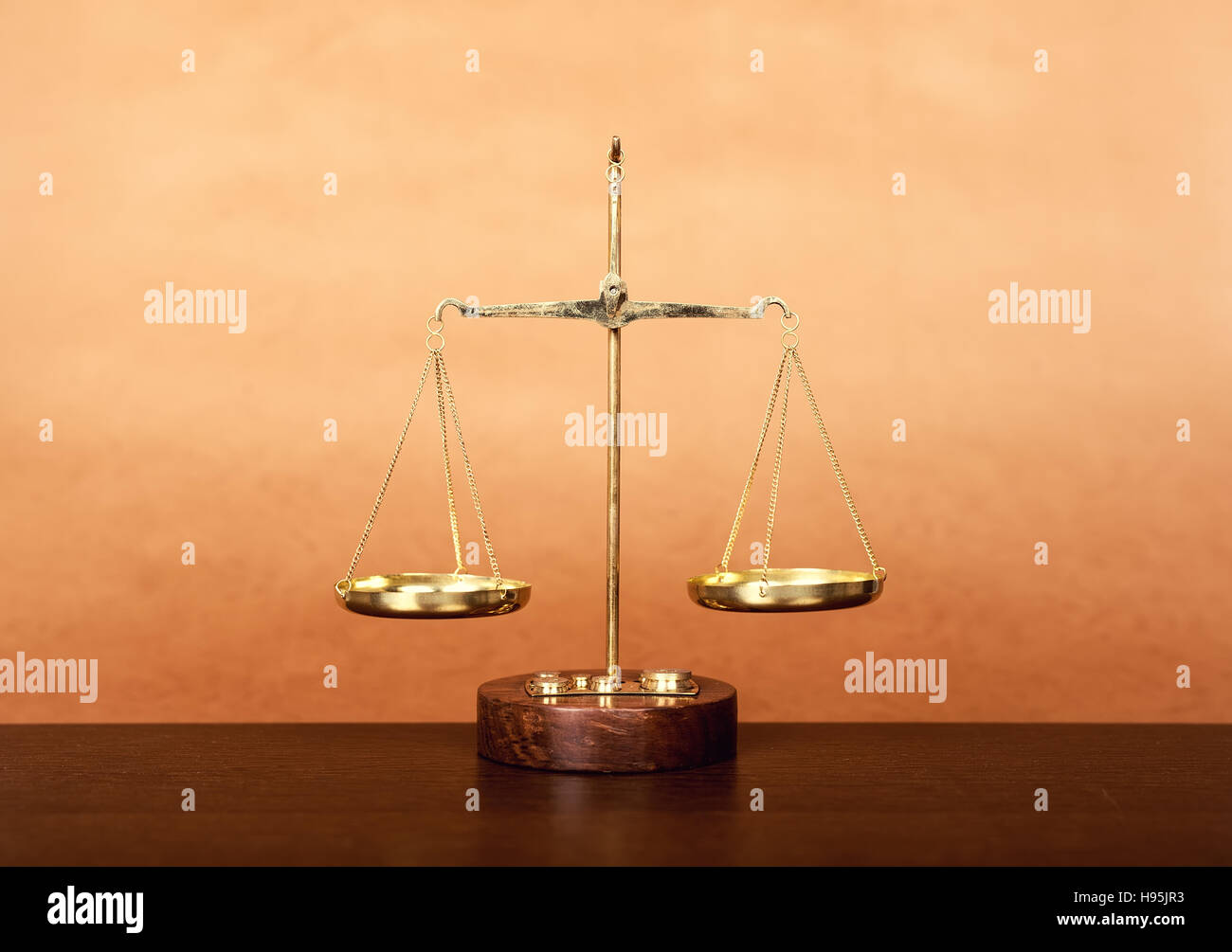 scales on wooden table, law concept Stock Photo - Alamy