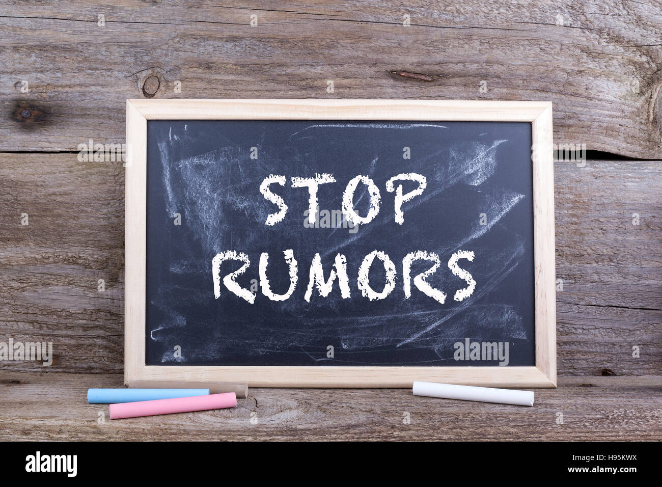STOP RUMORS. Text on blackboard Stock Photo - Alamy