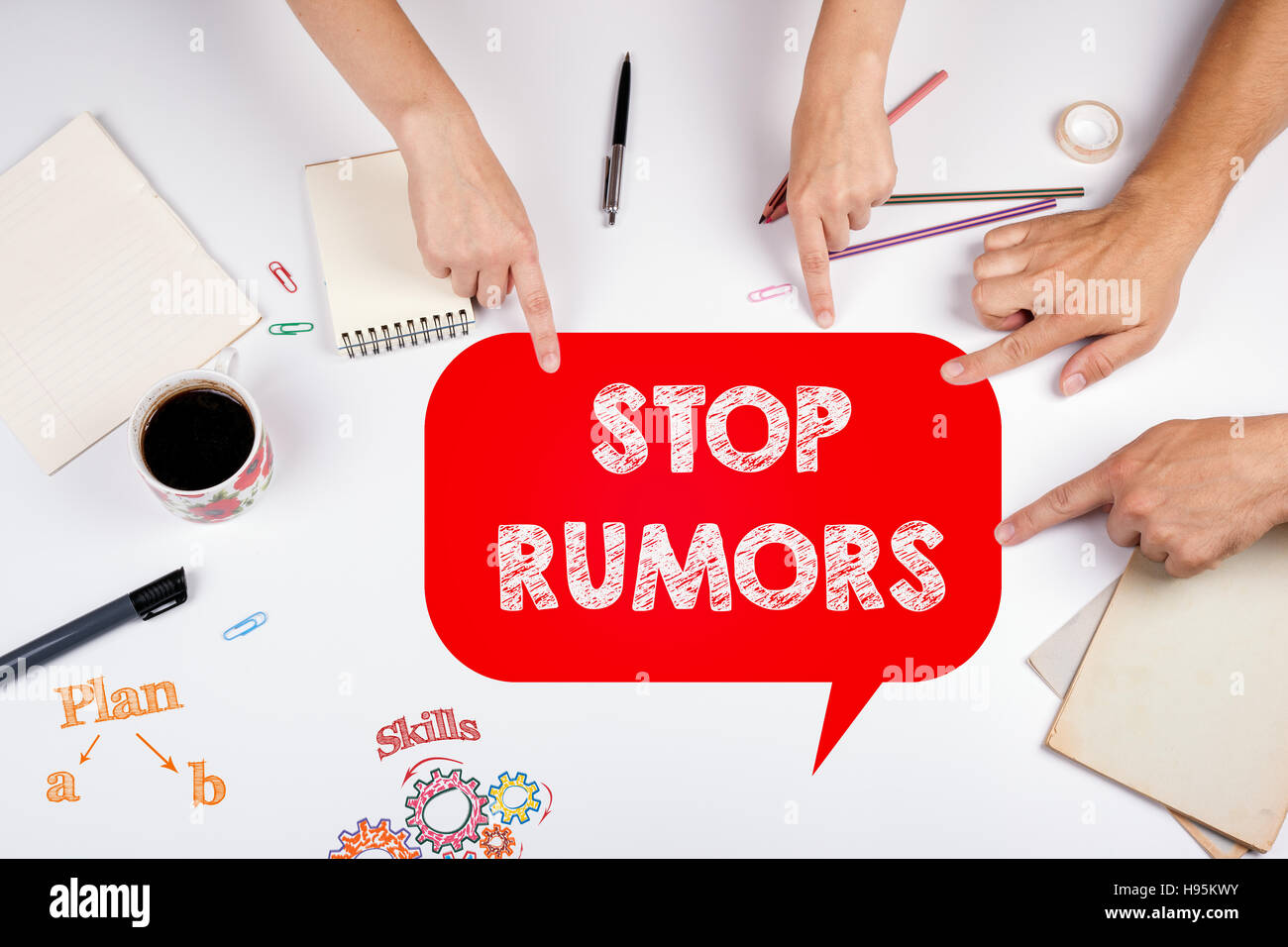 Stop Rumors. The meeting at the white office table Stock Photo - Alamy