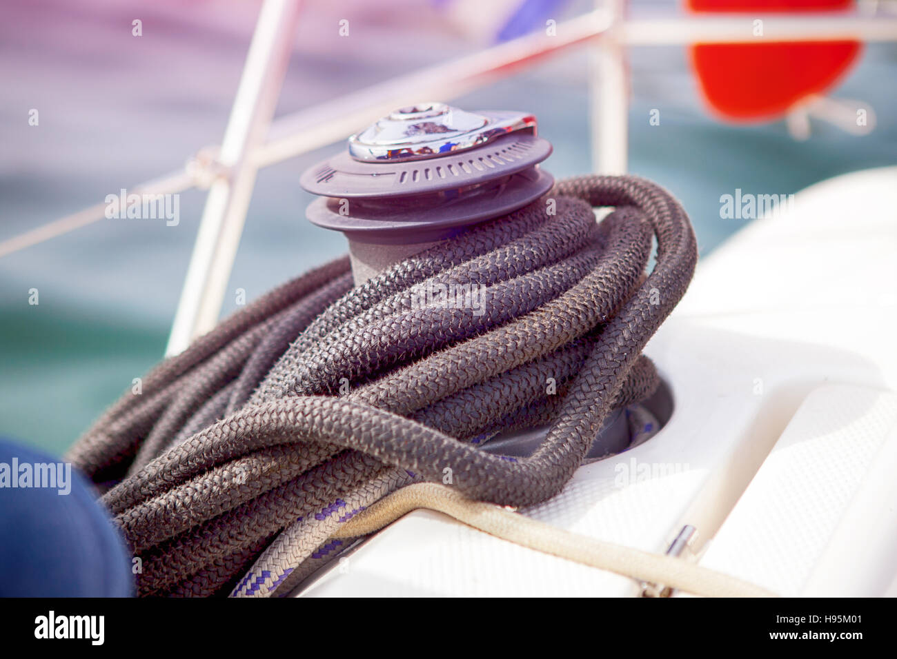 Winch with blue rope on a yacht Stock Photo - Alamy
