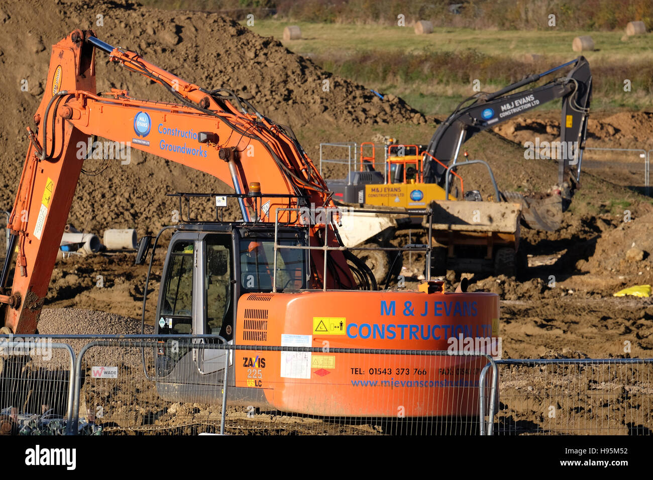 Heavy machinery being used to level the ground for house building ...