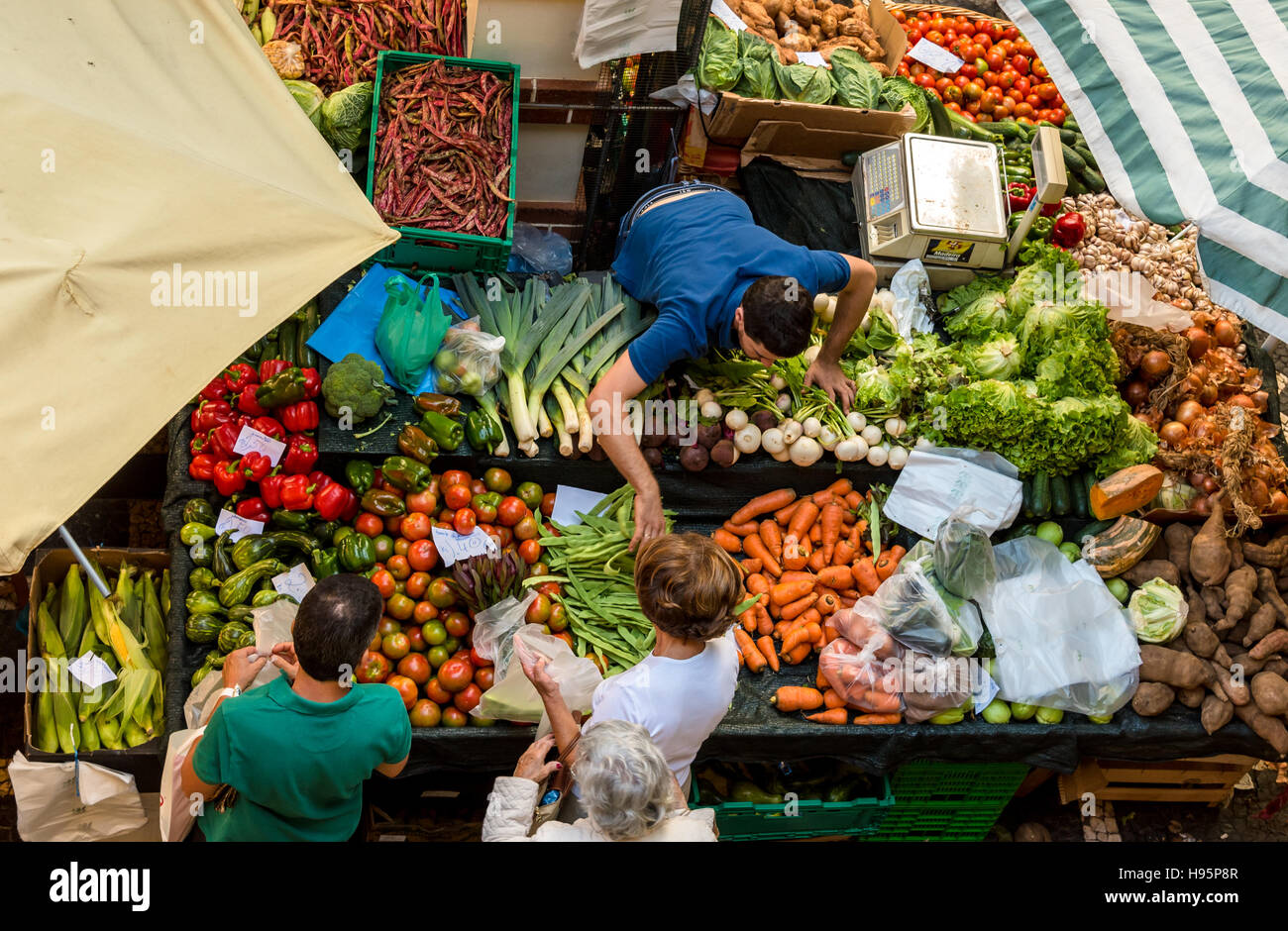 Busy market stall in the fruit and vegetable market in Funchal, Madeira ...