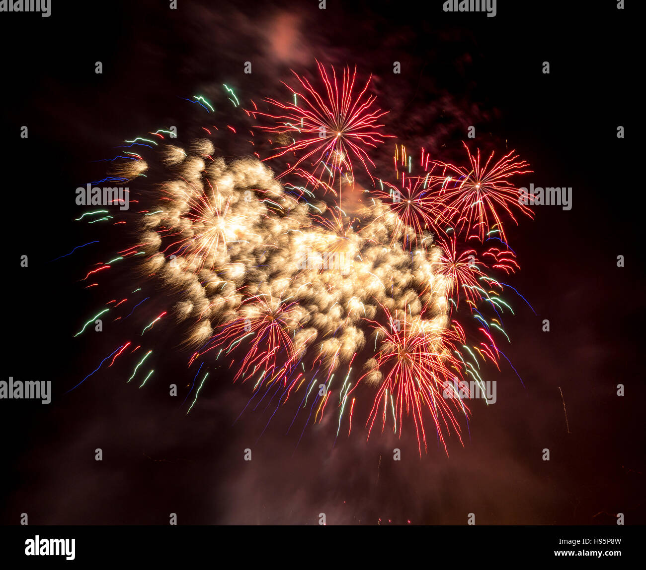 Fireworks bursting in the night sky on November the fifth, bonfire ...