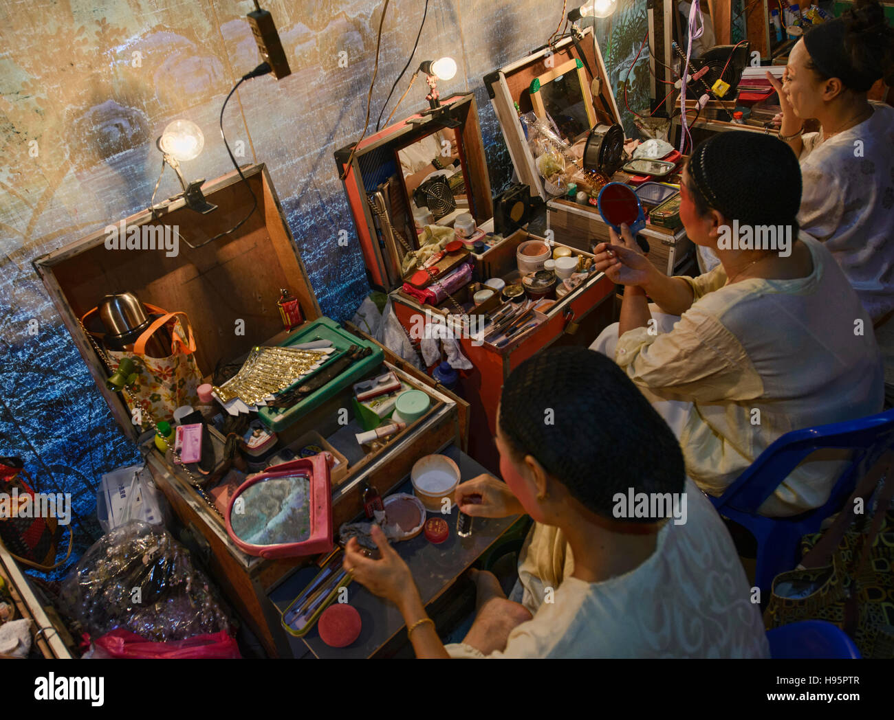 Chinese opera performers putting on a makeup at the Vegetarian Festival ...
