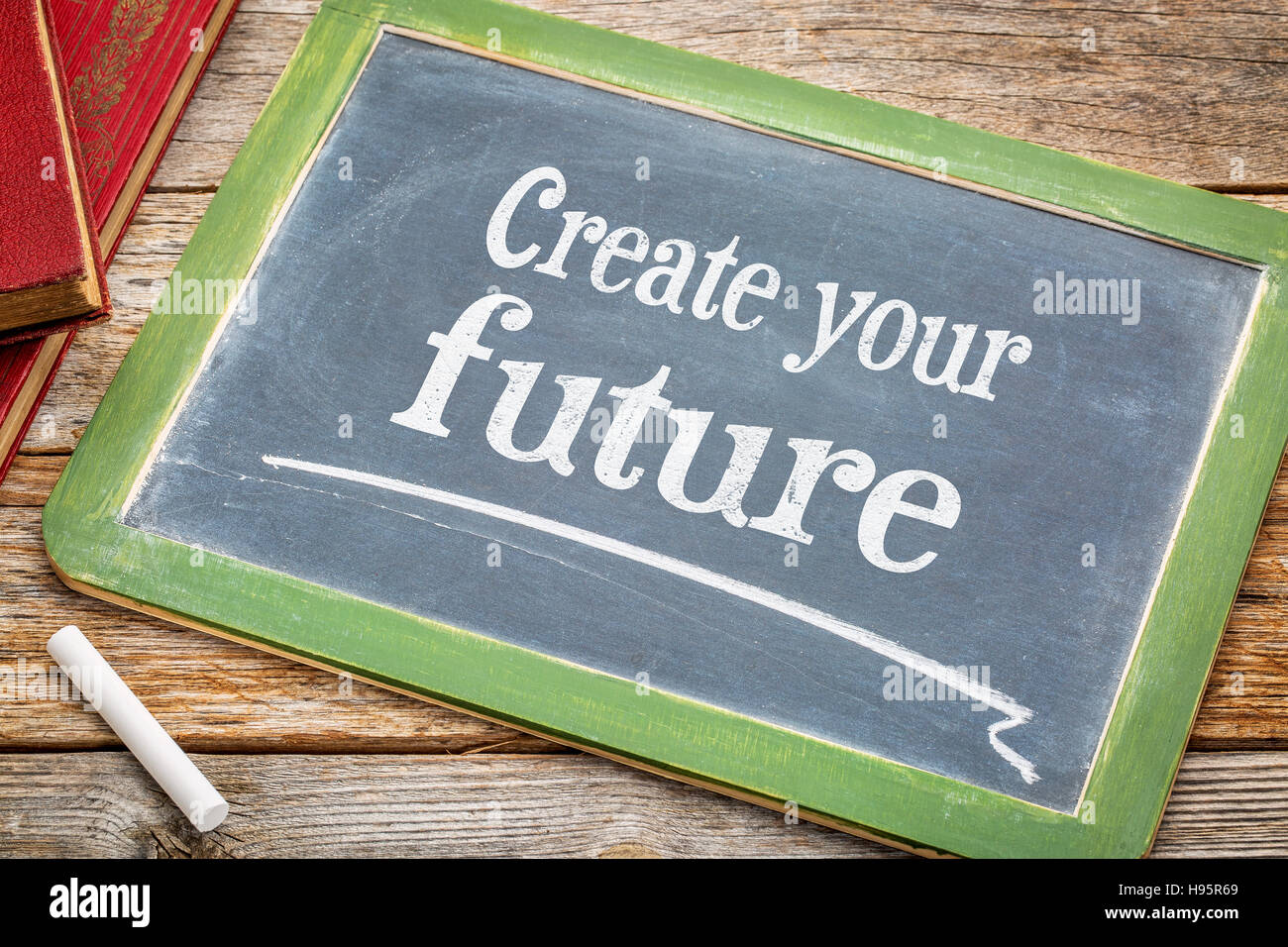 create your future - text on a slate blackboard with a white chalk and ...