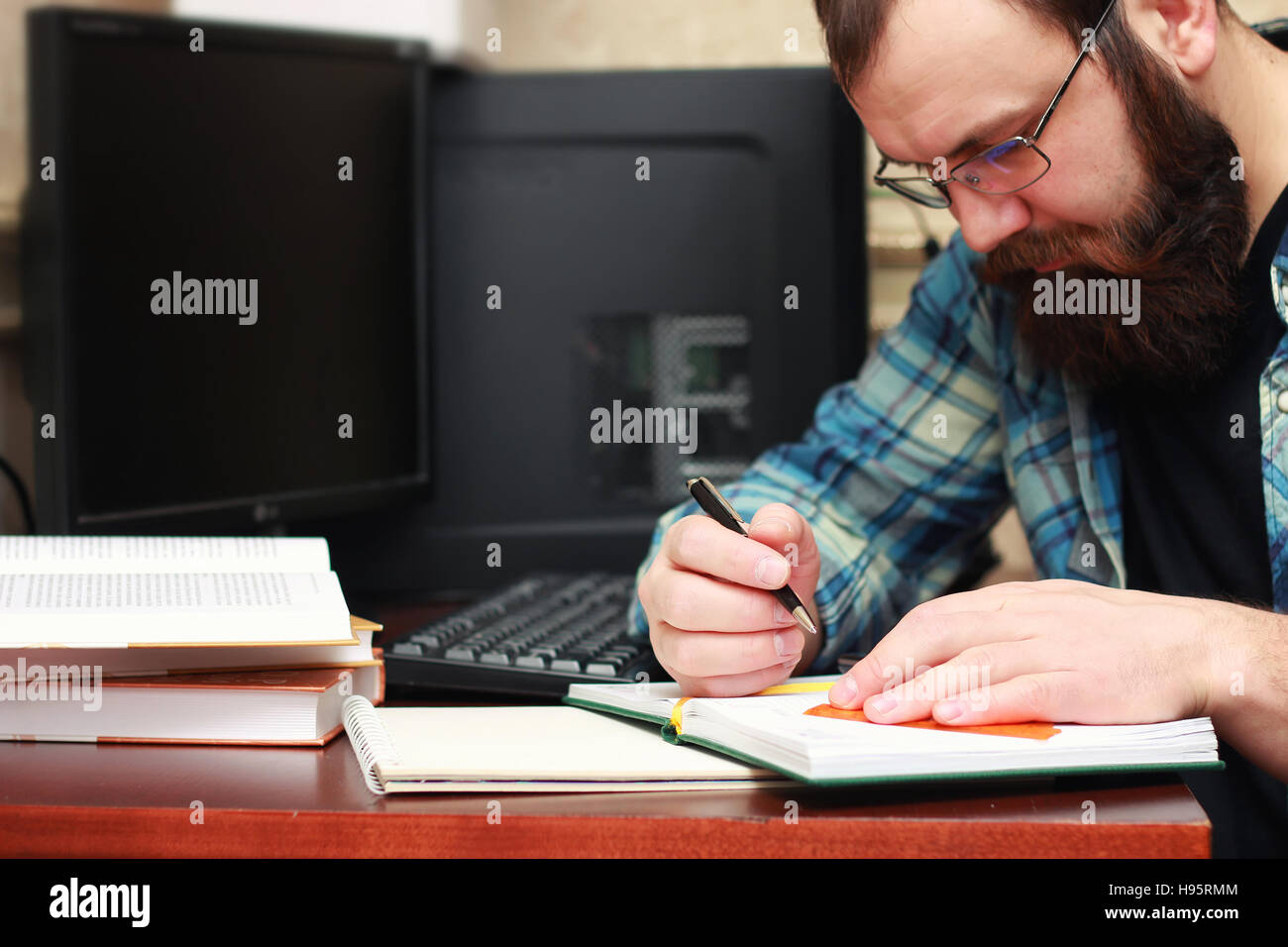 man write pen table Stock Photo - Alamy
