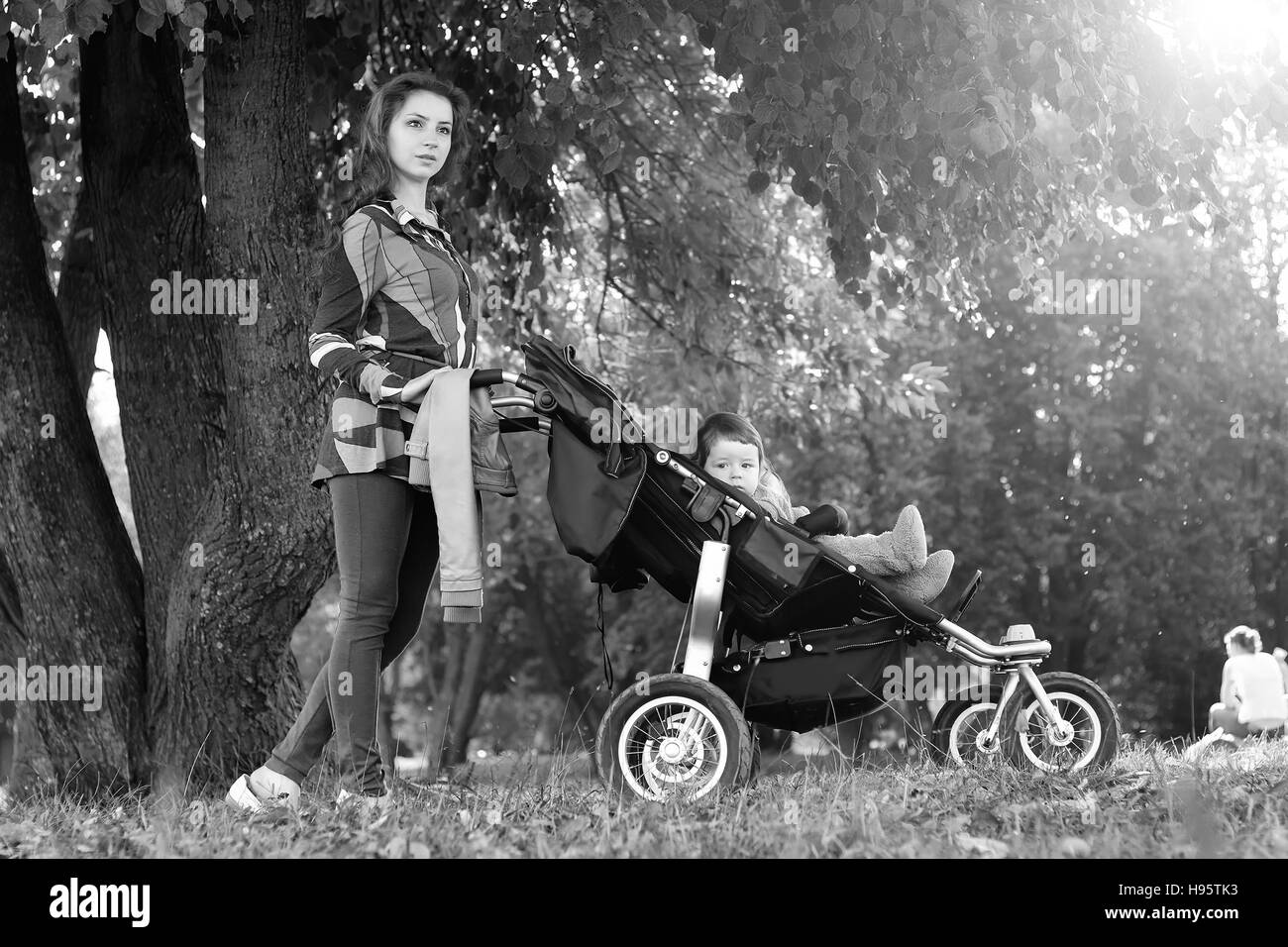 walk women with stroller summer sunlight Stock Photo - Alamy