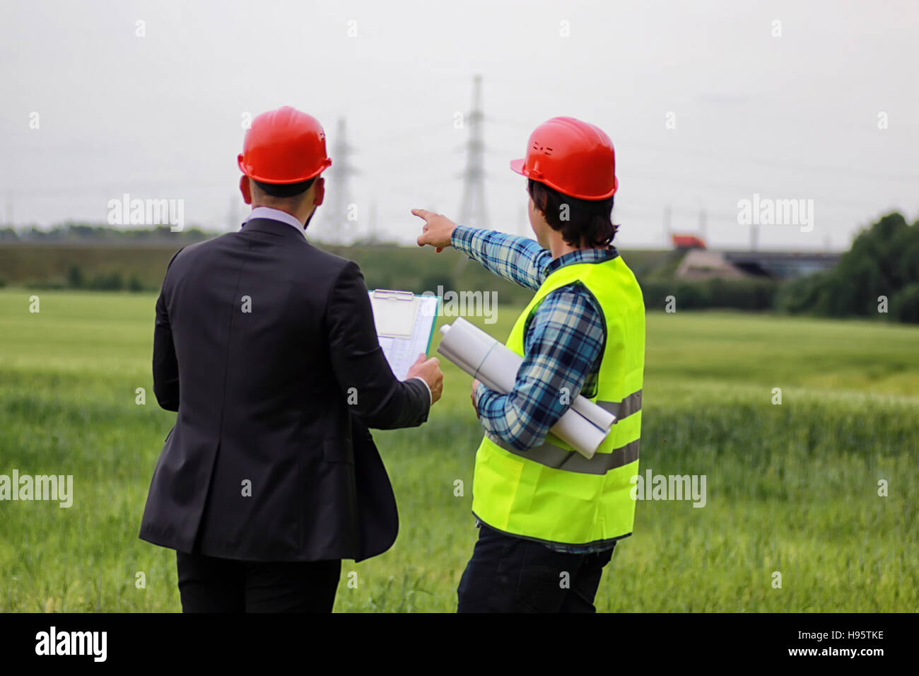 construction two man in the field Stock Photo - Alamy
