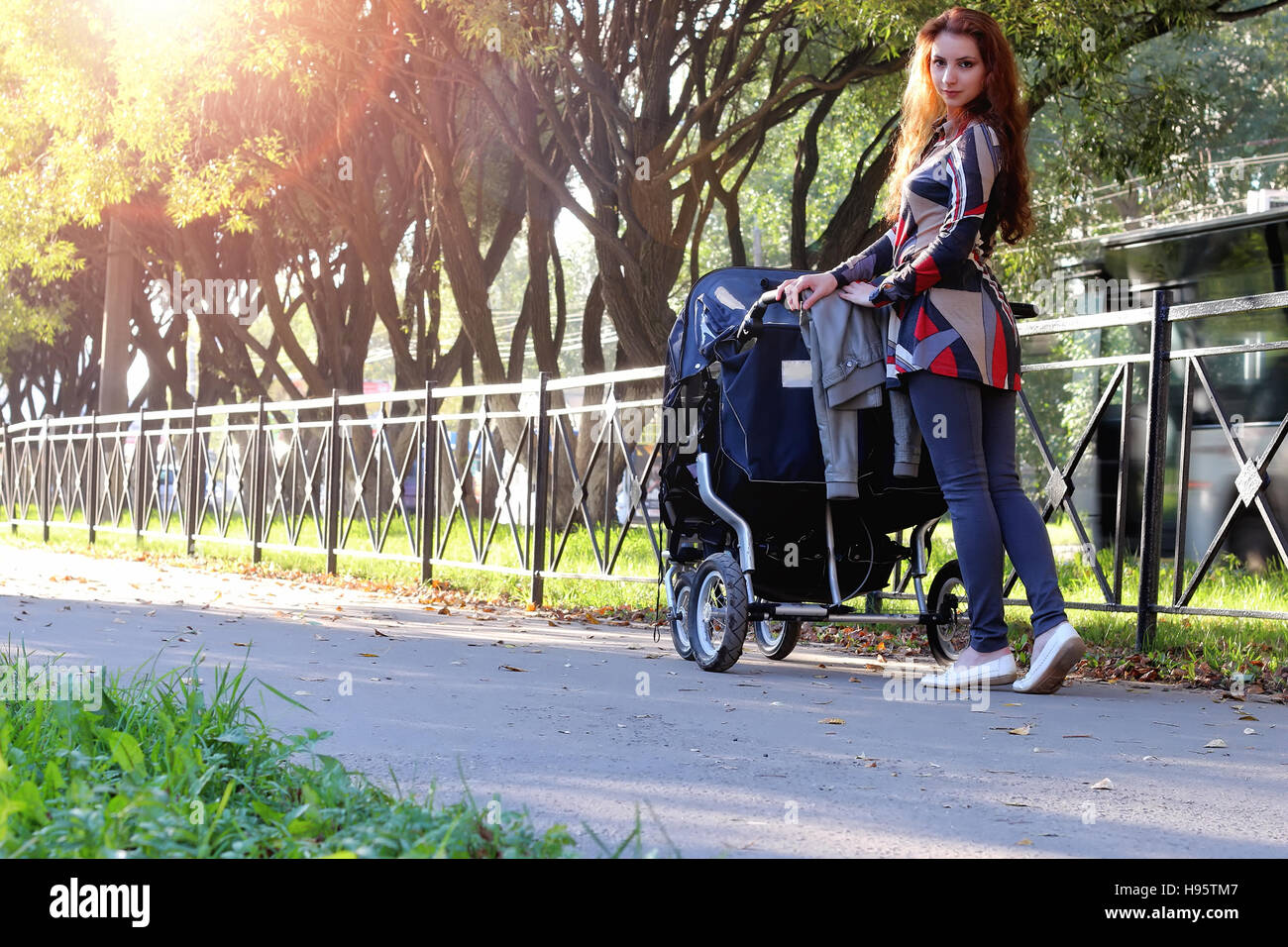 walk women with stroller summer sunlight Stock Photo - Alamy