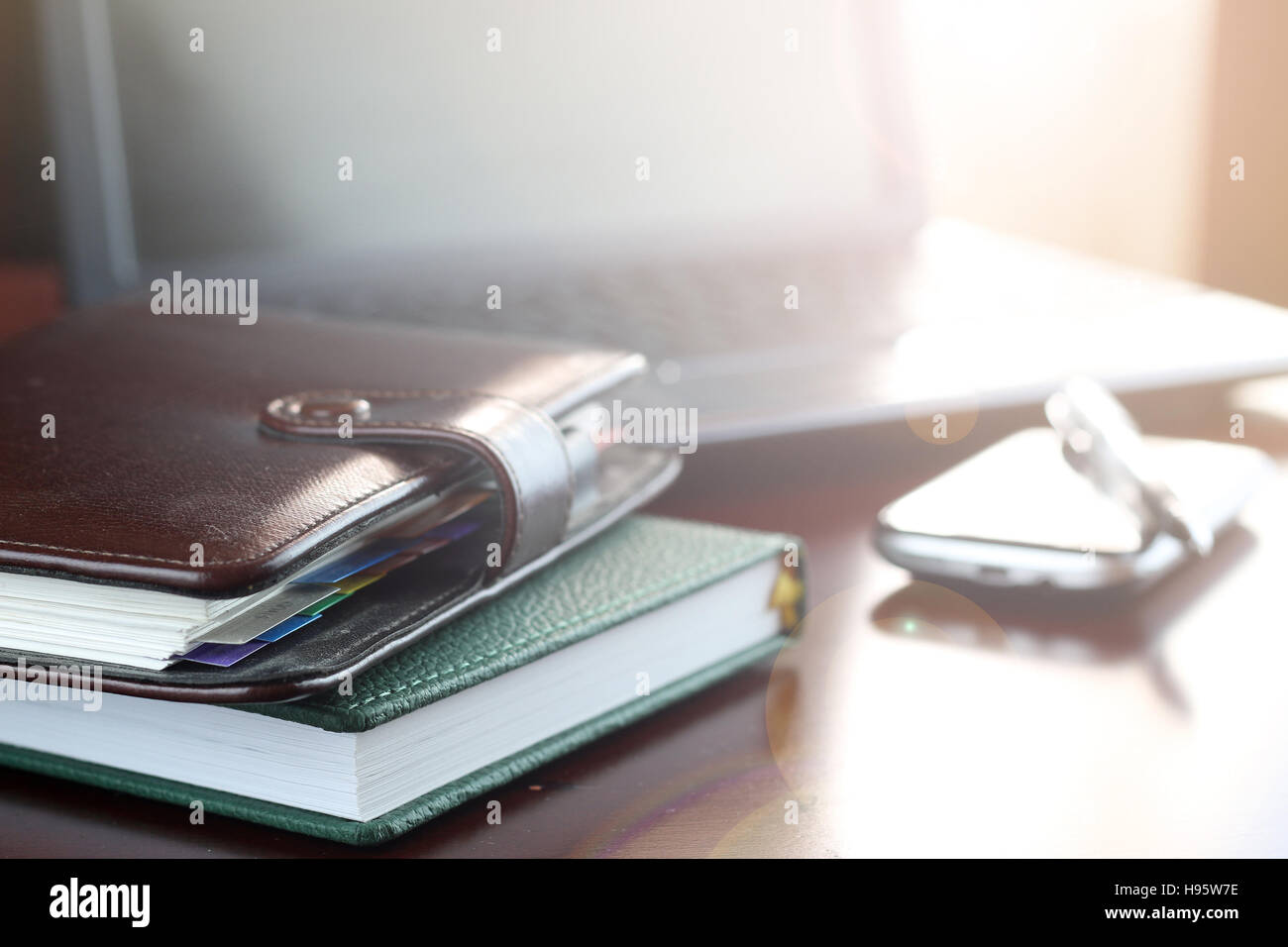 office desk with a computer and a telephone diary Stock Photo - Alamy