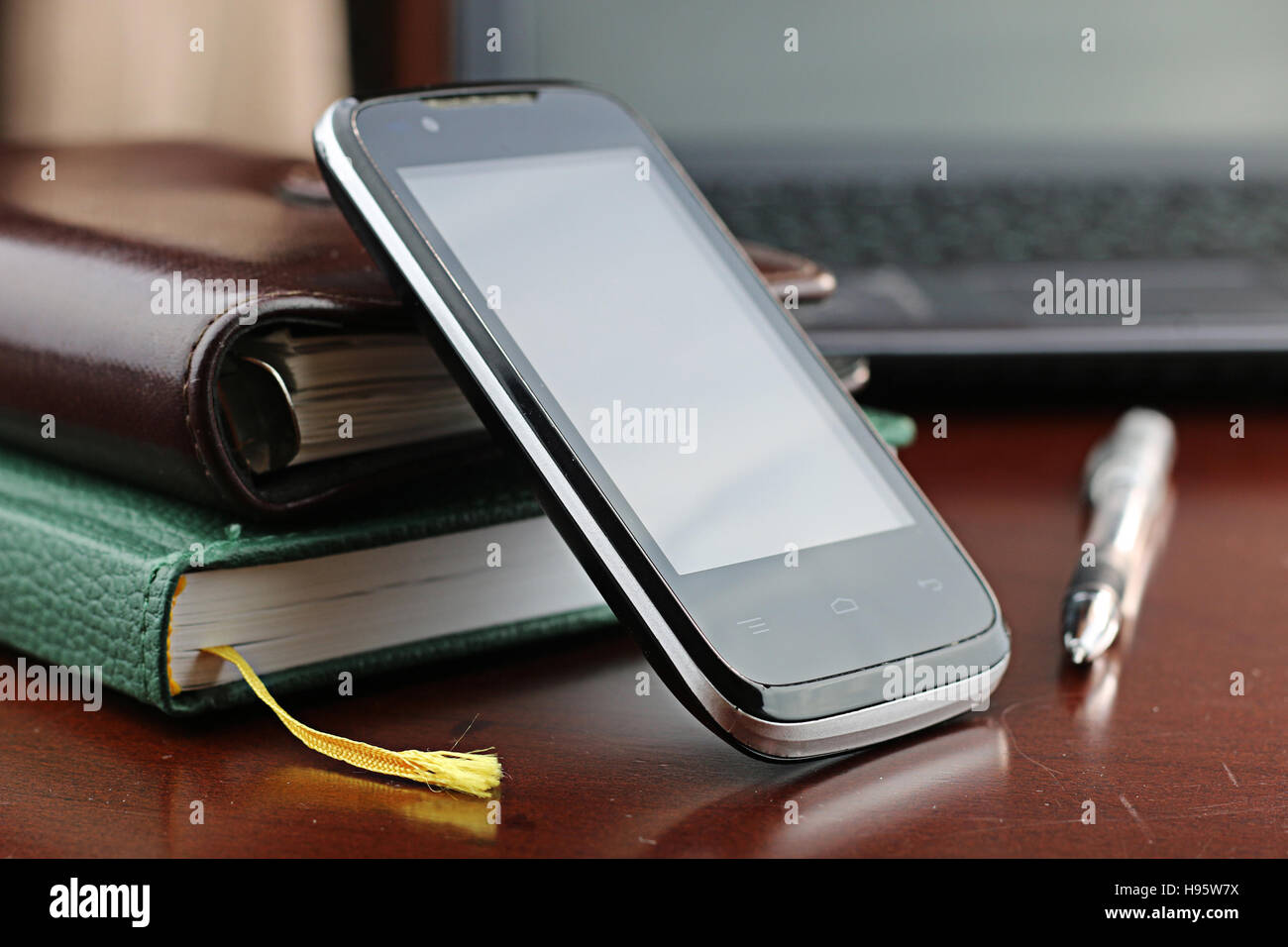 office desk with a computer and a telephone diary Stock Photo - Alamy