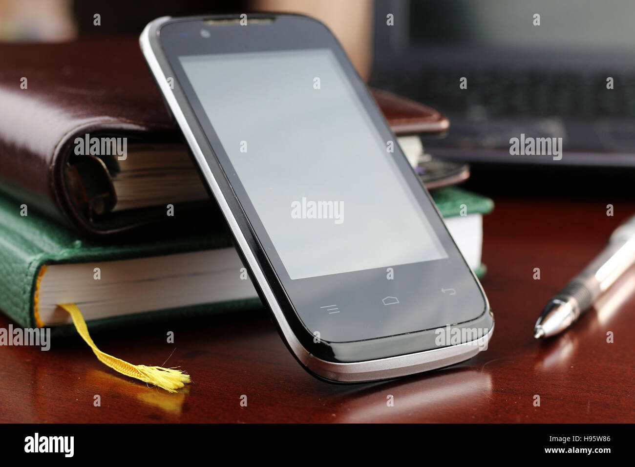 office desk with a computer and a telephone diary Stock Photo - Alamy