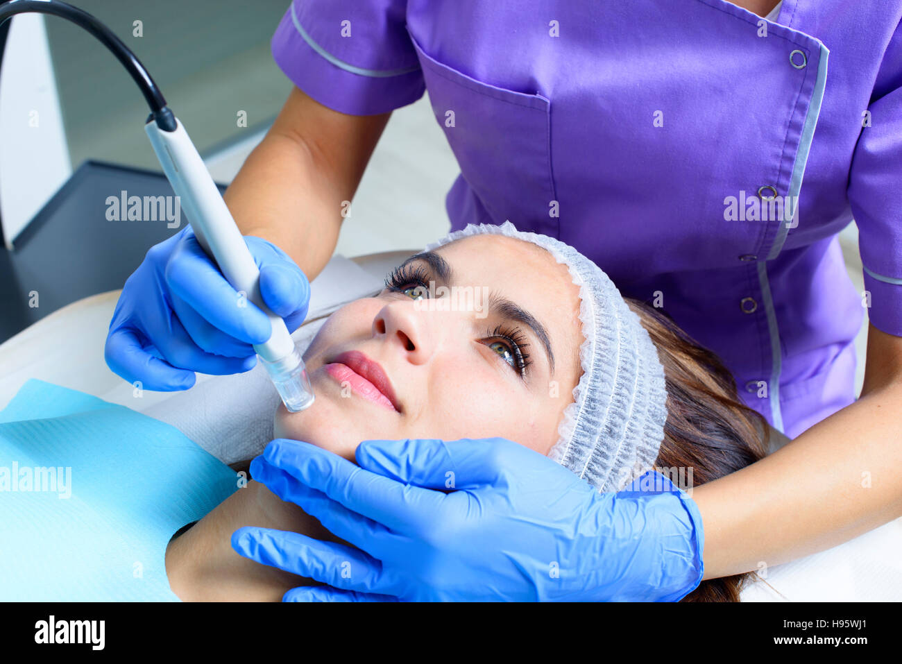 beauty treatment of a young woman in specialized clinic Stock Photo - Alamy