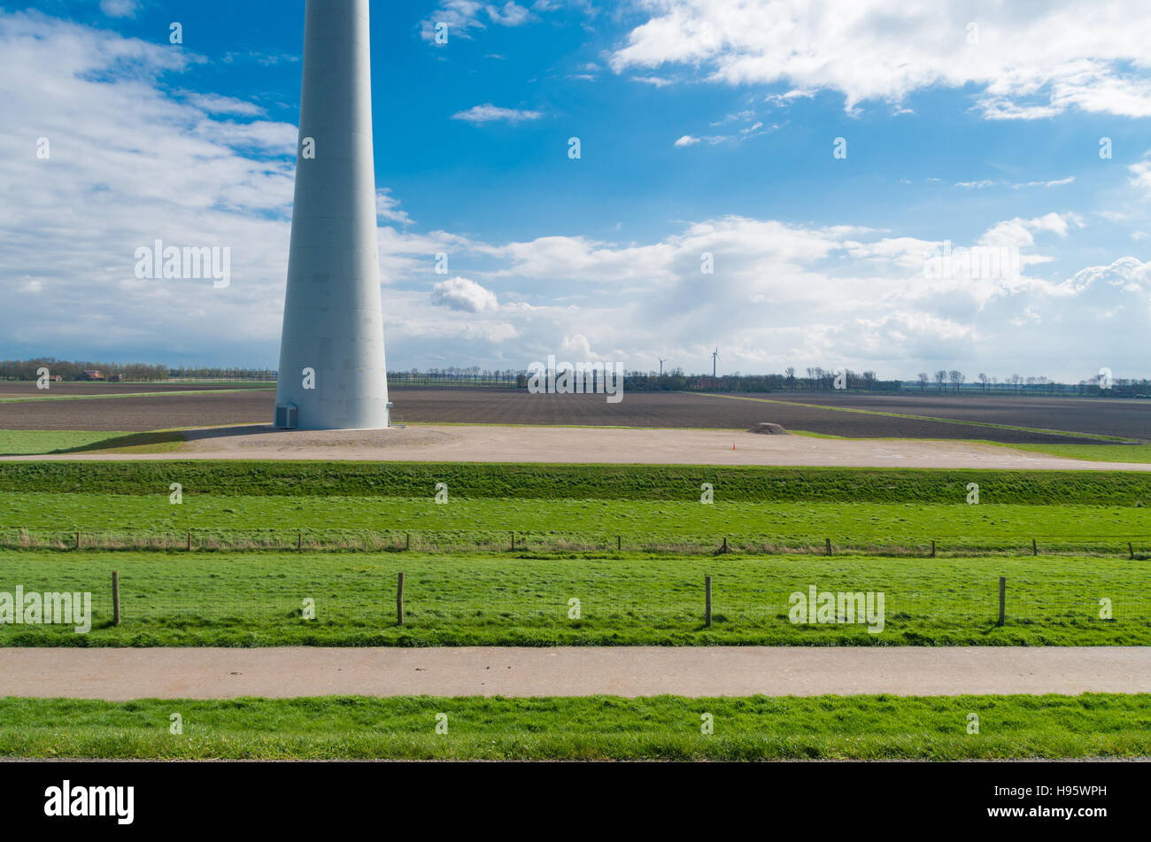 lower part of a windmill in a flat dutch landscape Stock Photo - Alamy