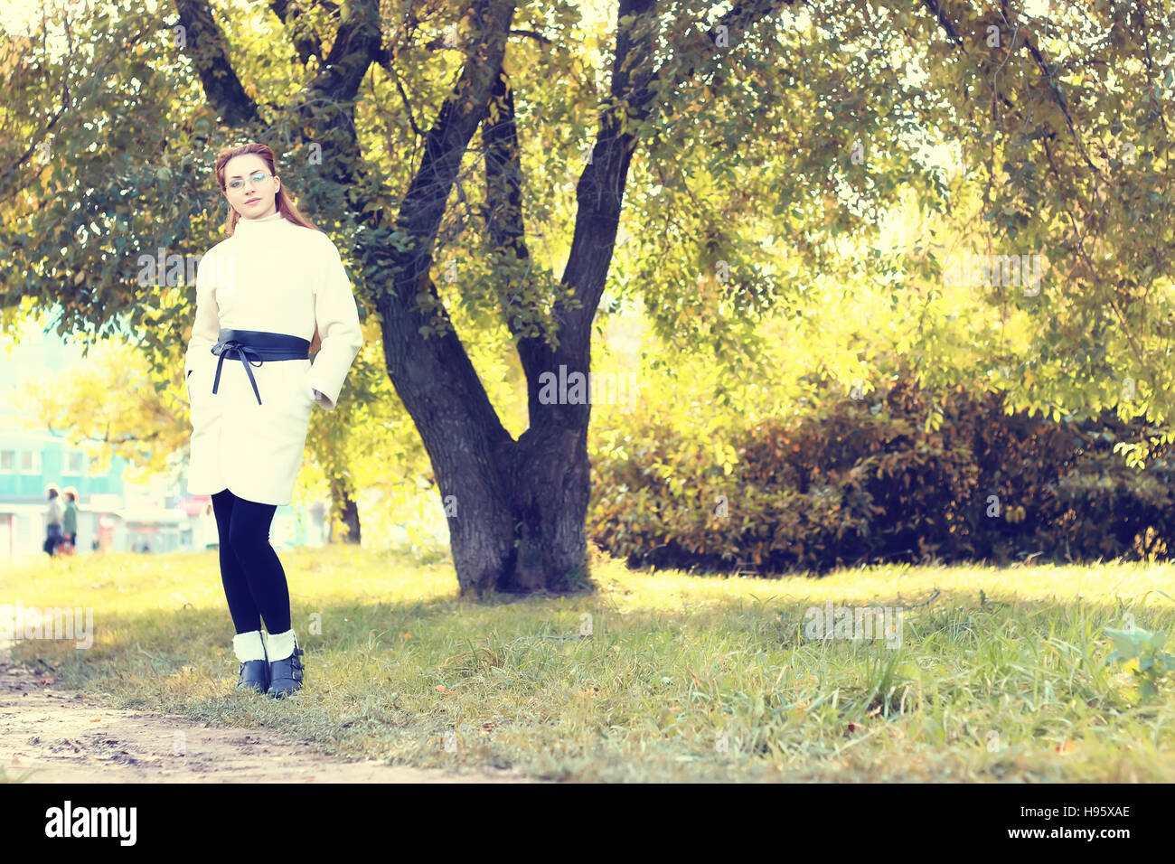 girl in a park walk autumn alone Stock Photo - Alamy