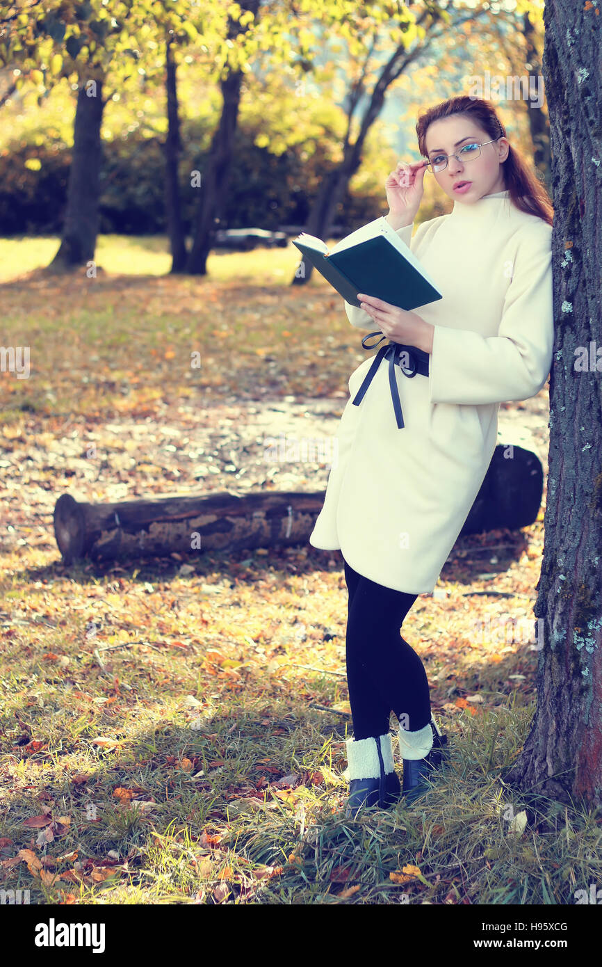 girl in a park walk autumn alone Stock Photo - Alamy