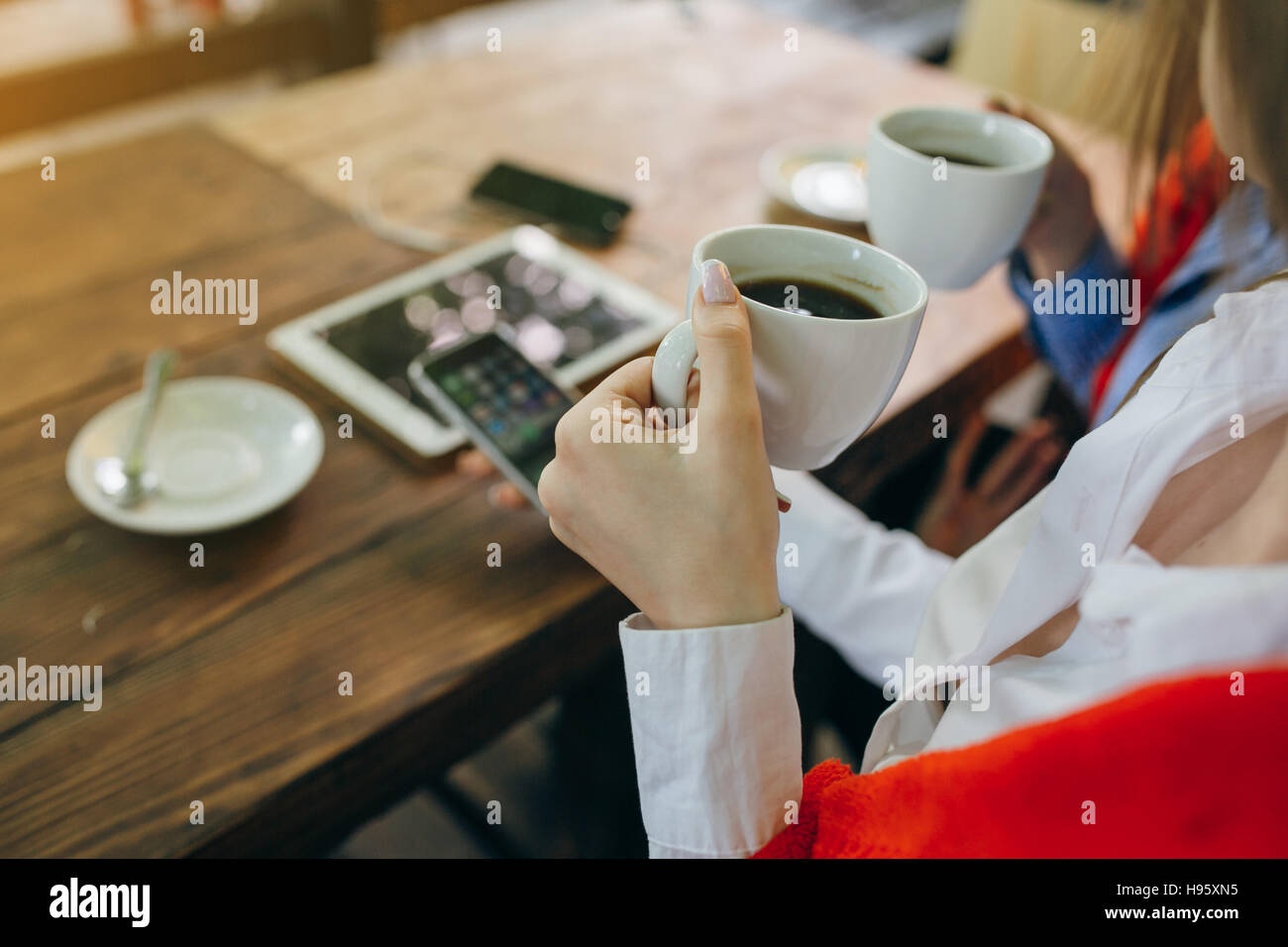 girls use their break from work to drink coffee and chat Stock Photo ...