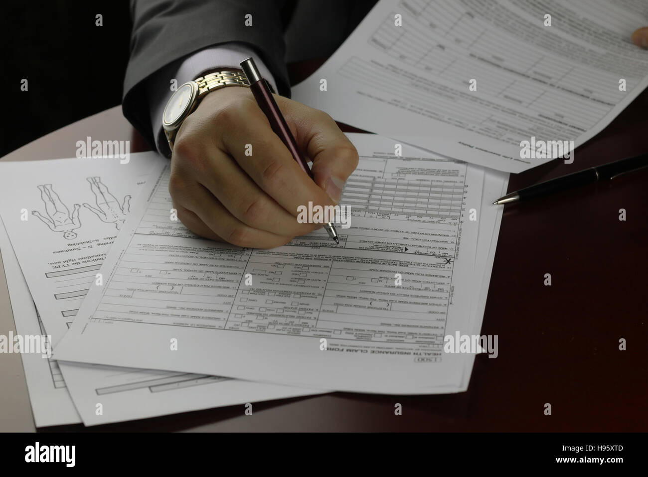 hand signed insurance Stock Photo - Alamy