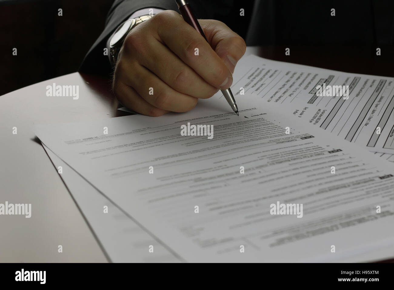 hand signed tax form Stock Photo - Alamy