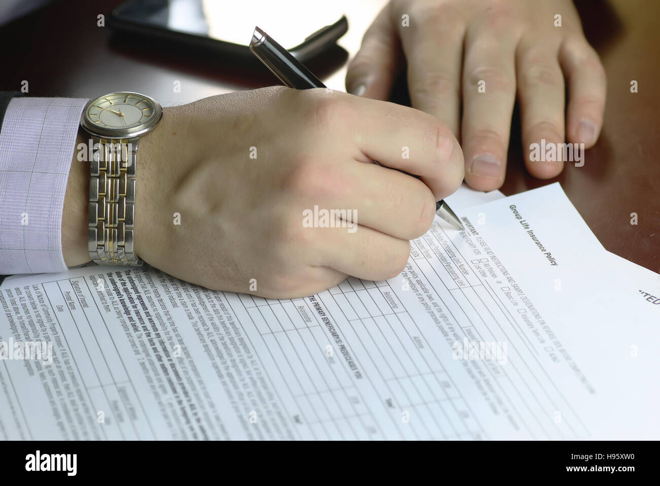 hand signed insurance Stock Photo - Alamy
