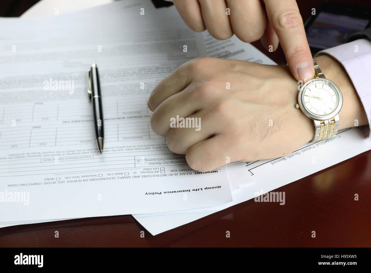 hand signed insurance Stock Photo - Alamy