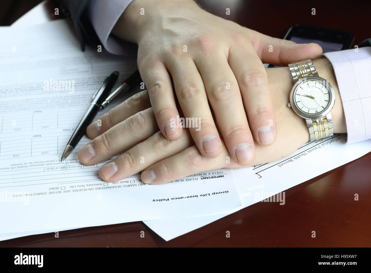 hand signed insurance Stock Photo - Alamy