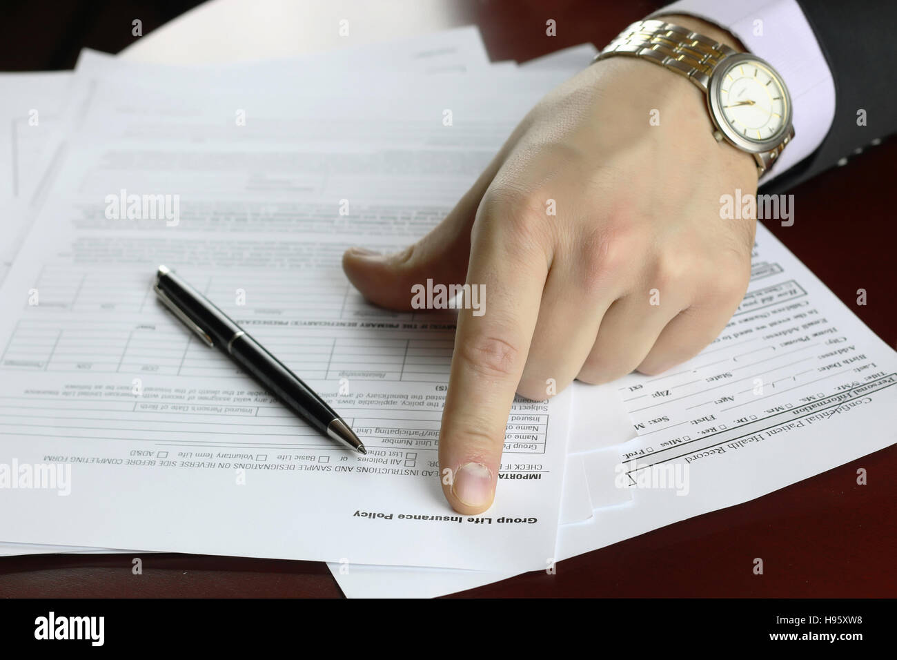 hand signed insurance Stock Photo - Alamy