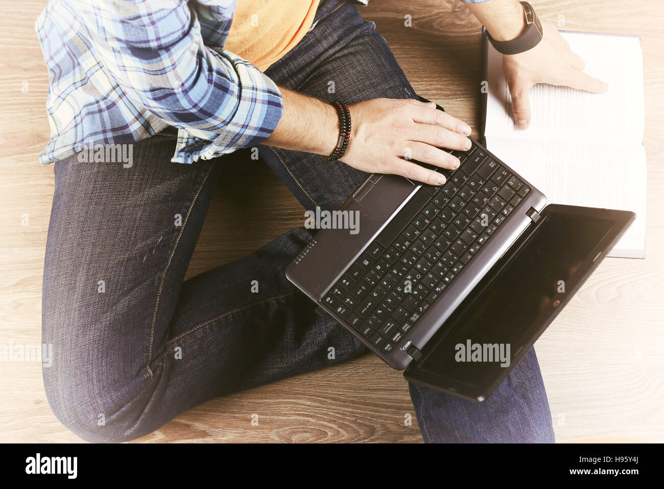 man on the floor with a laptop Stock Photo - Alamy