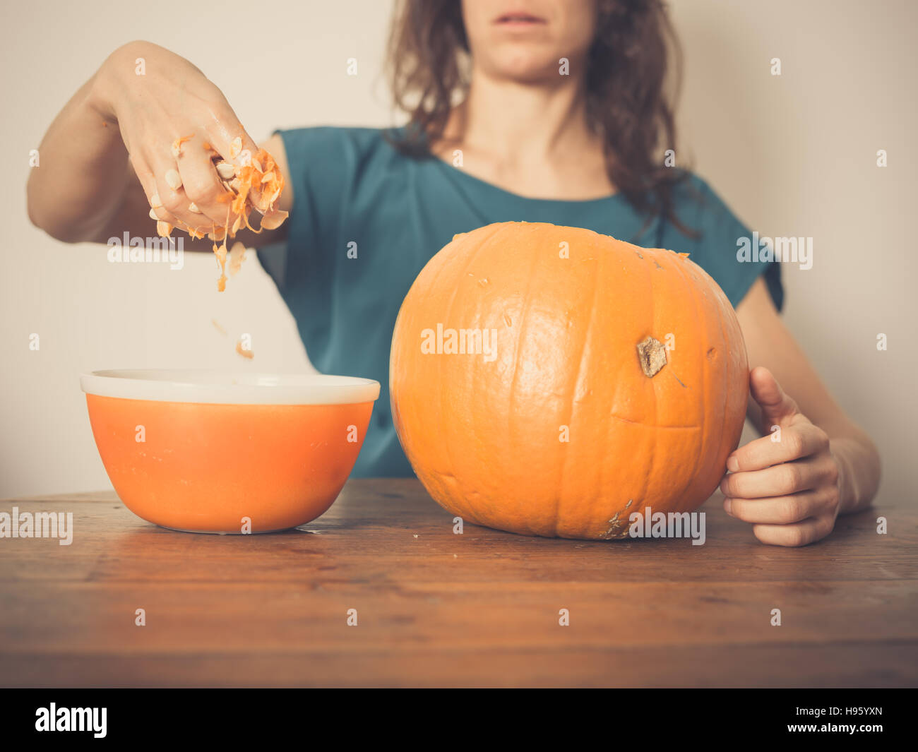 Woman and pumpkin seeds hi-res stock photography and images - Alamy