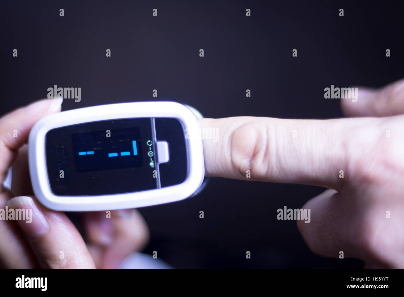 Portable hand held domestic cardiac finger pulse rate meter to show ...