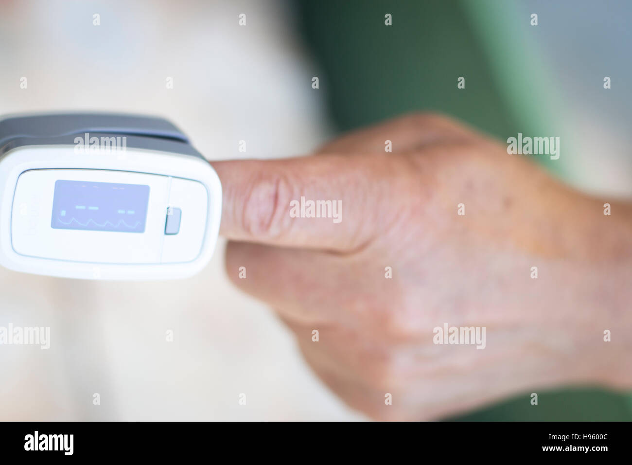 Portable hand held domestic cardiac finger pulse rate meter to show ...