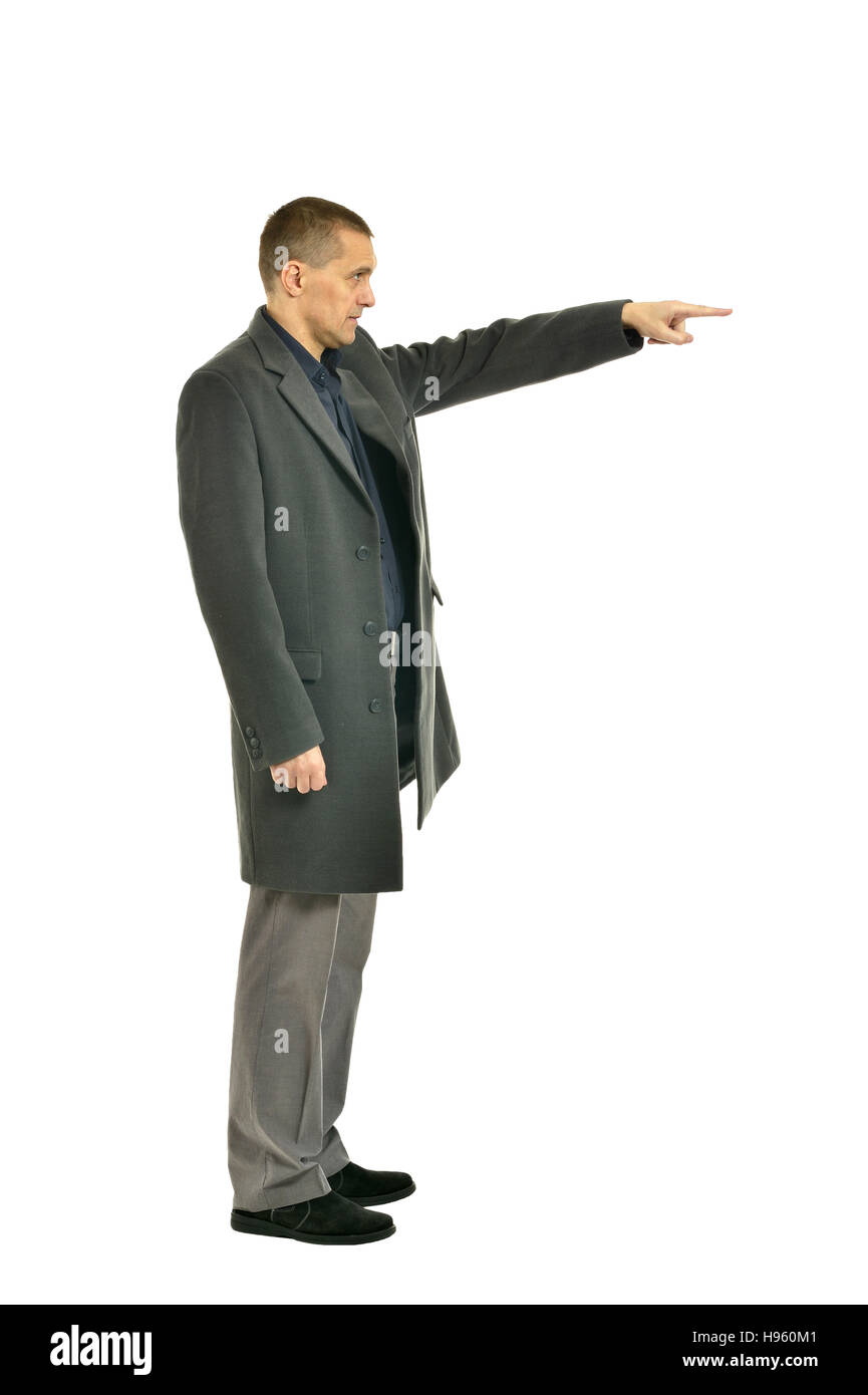 Handsome Man in coat pointing Stock Photo - Alamy