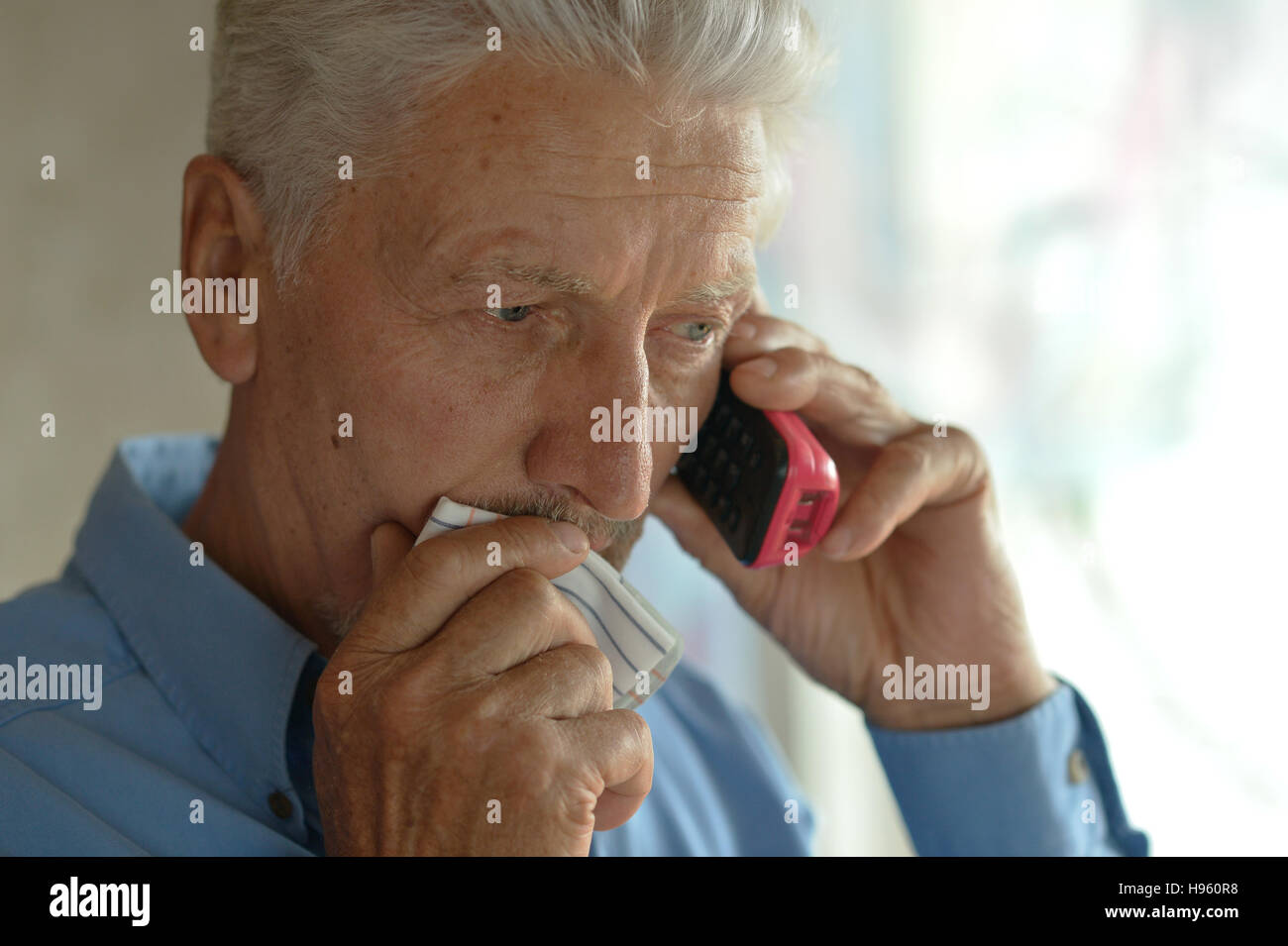 Sick old man calling doctor Stock Photo - Alamy