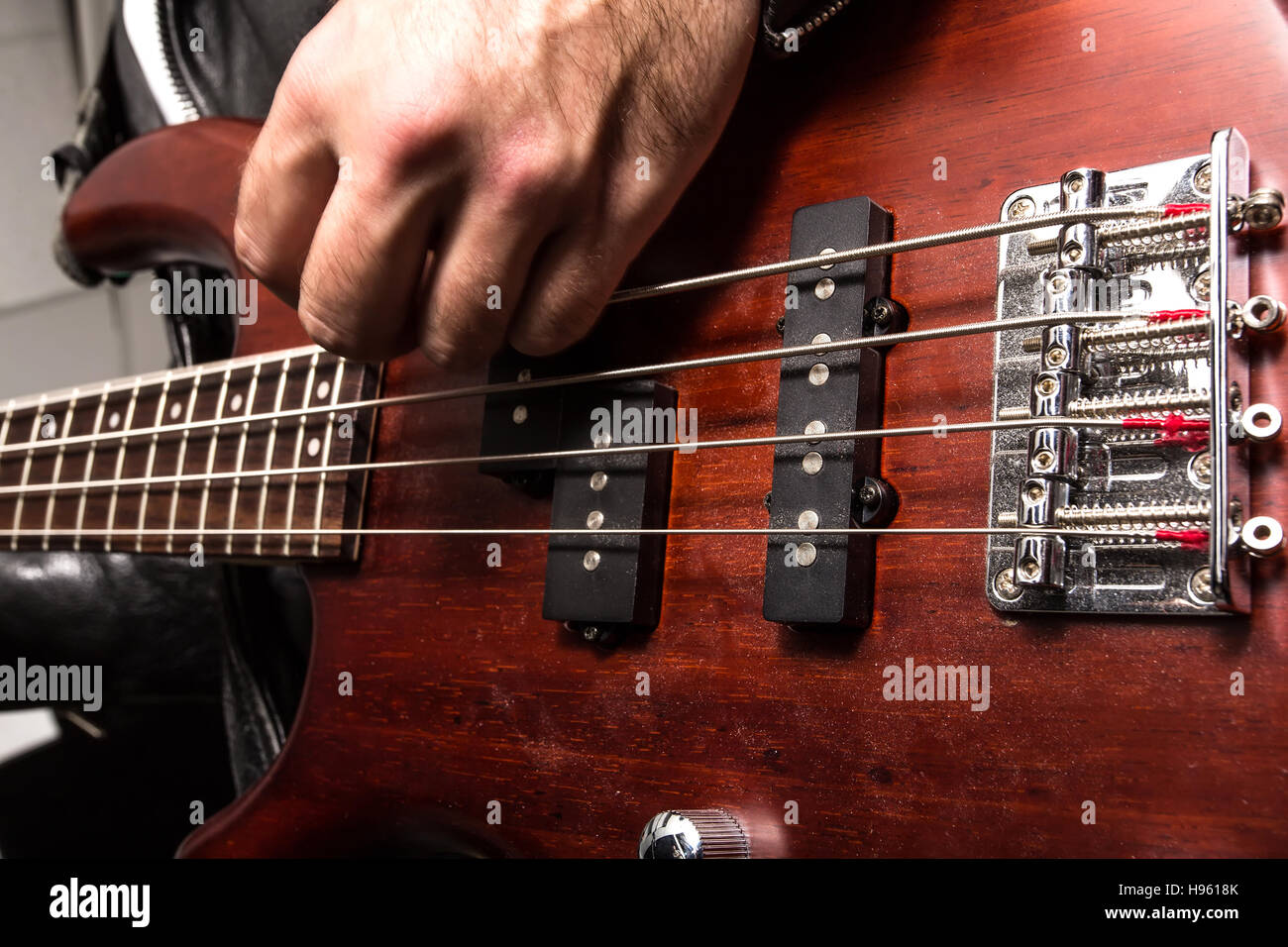A Rock musician playing bass in the rehearsal Studio Stock Photo - Alamy