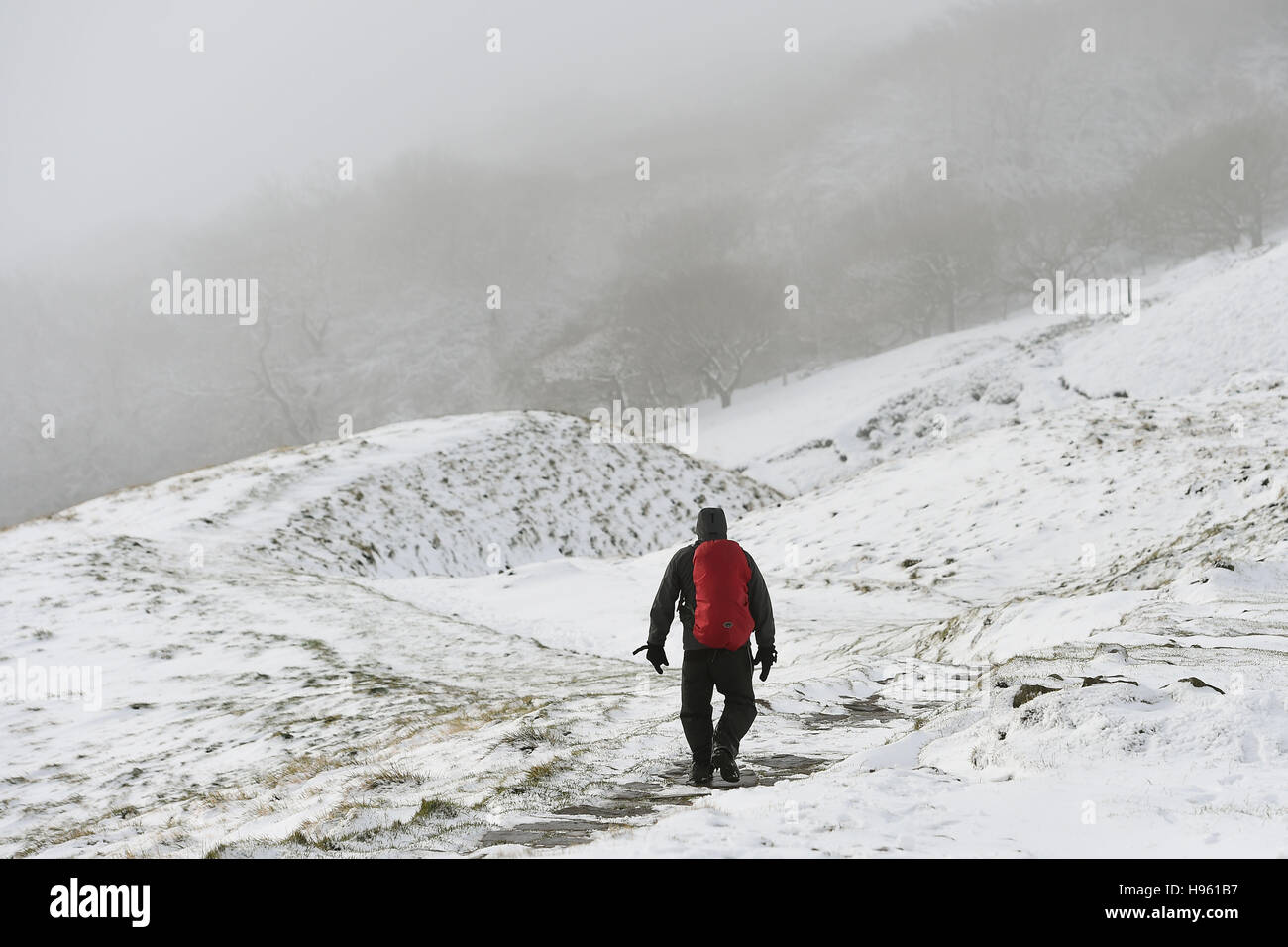 A walker makes his way down from the summit of Mam Tor in Derbyshire ...