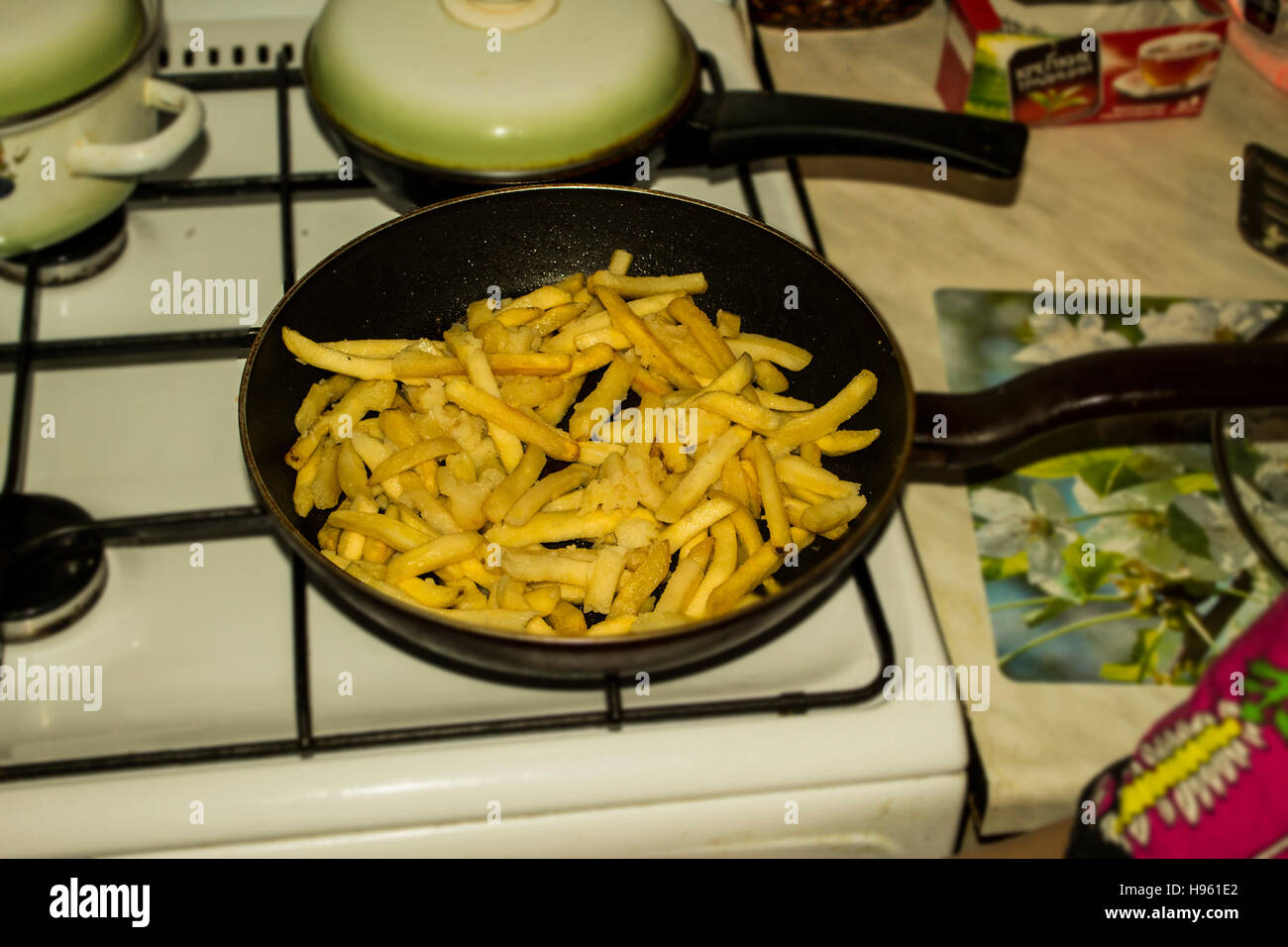 delicious fries roasted on frying pan Stock Photo - Alamy