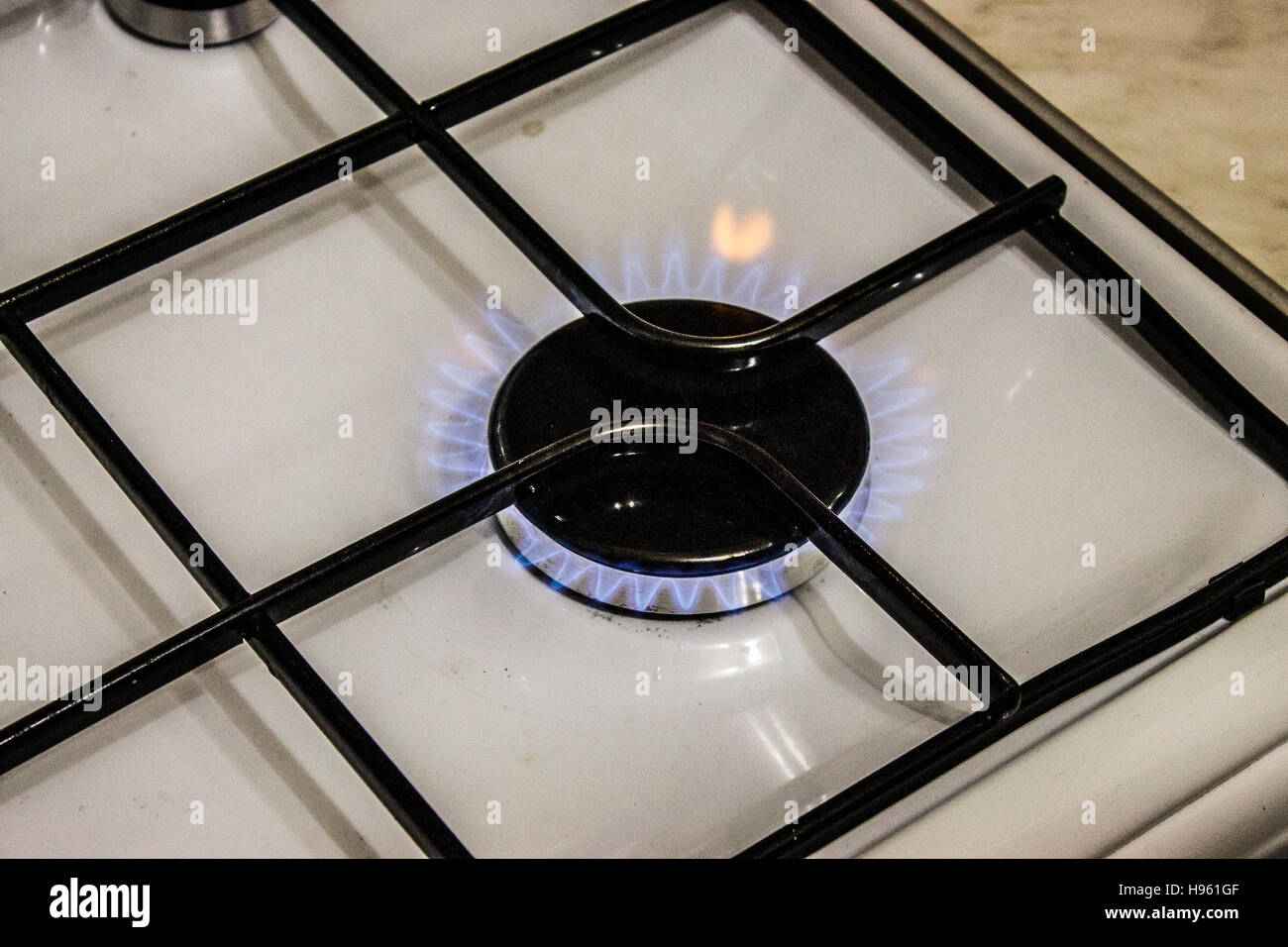 burning fire on a white tile for cooking Stock Photo - Alamy