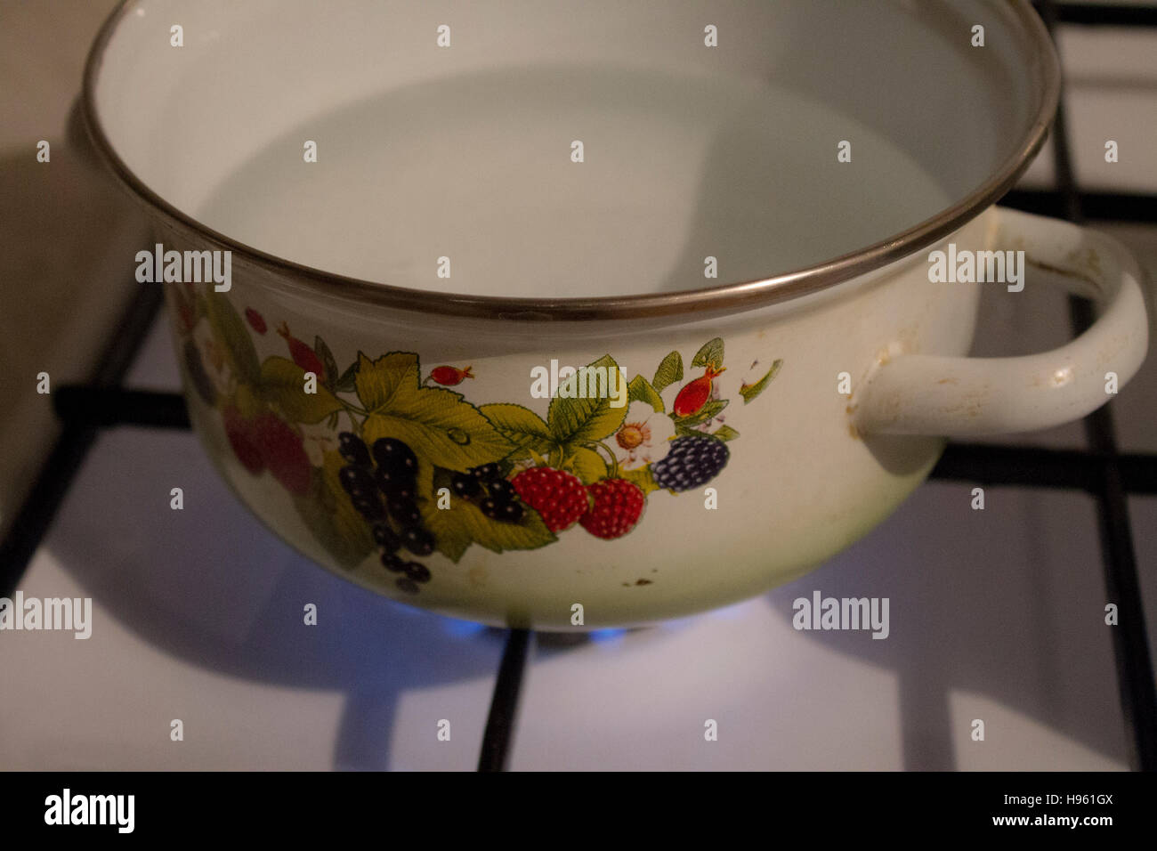 white pots on the gas stove Stock Photo - Alamy